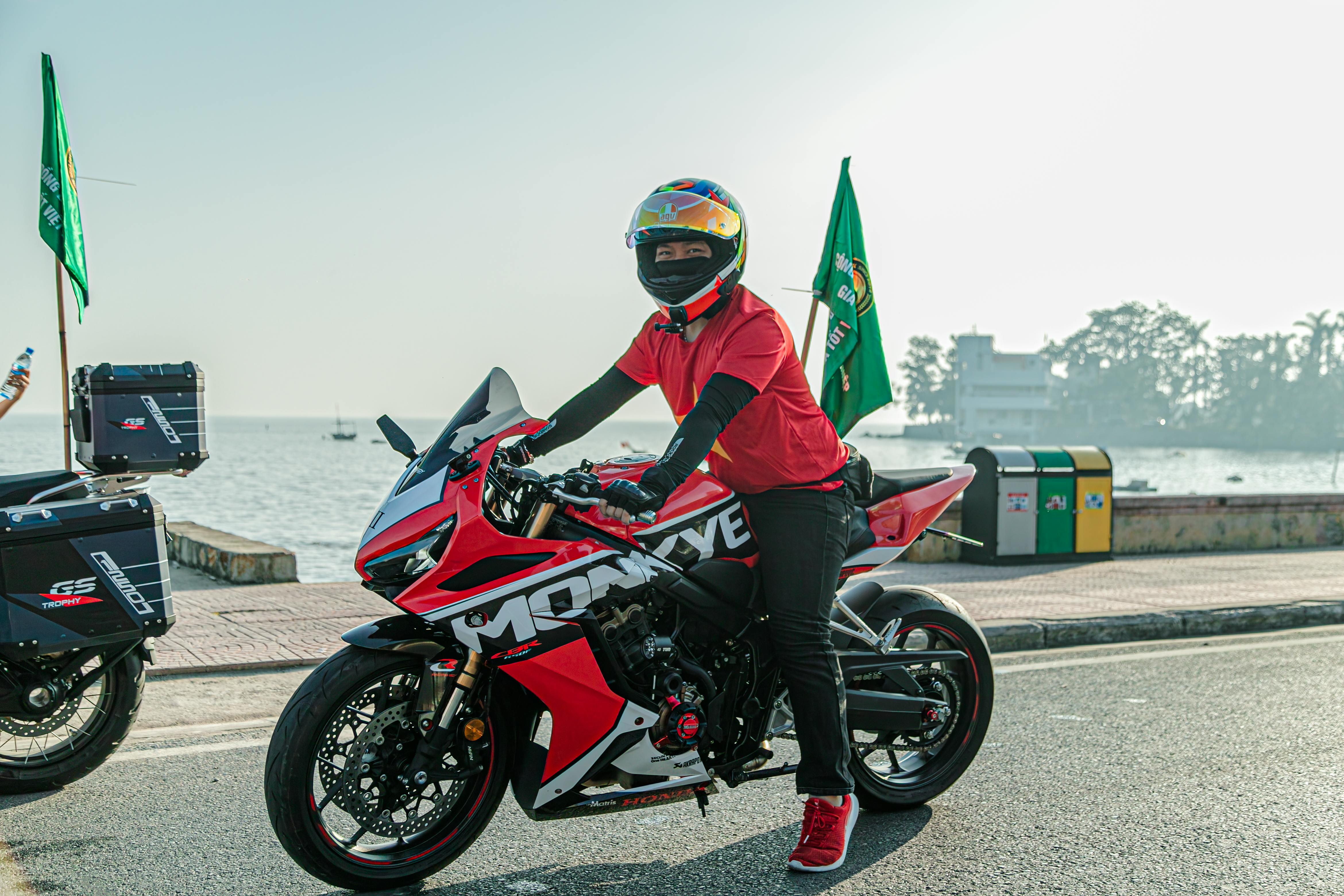 Motorcyclist Riding a Sportbike by the Seaside · Free Stock Photo