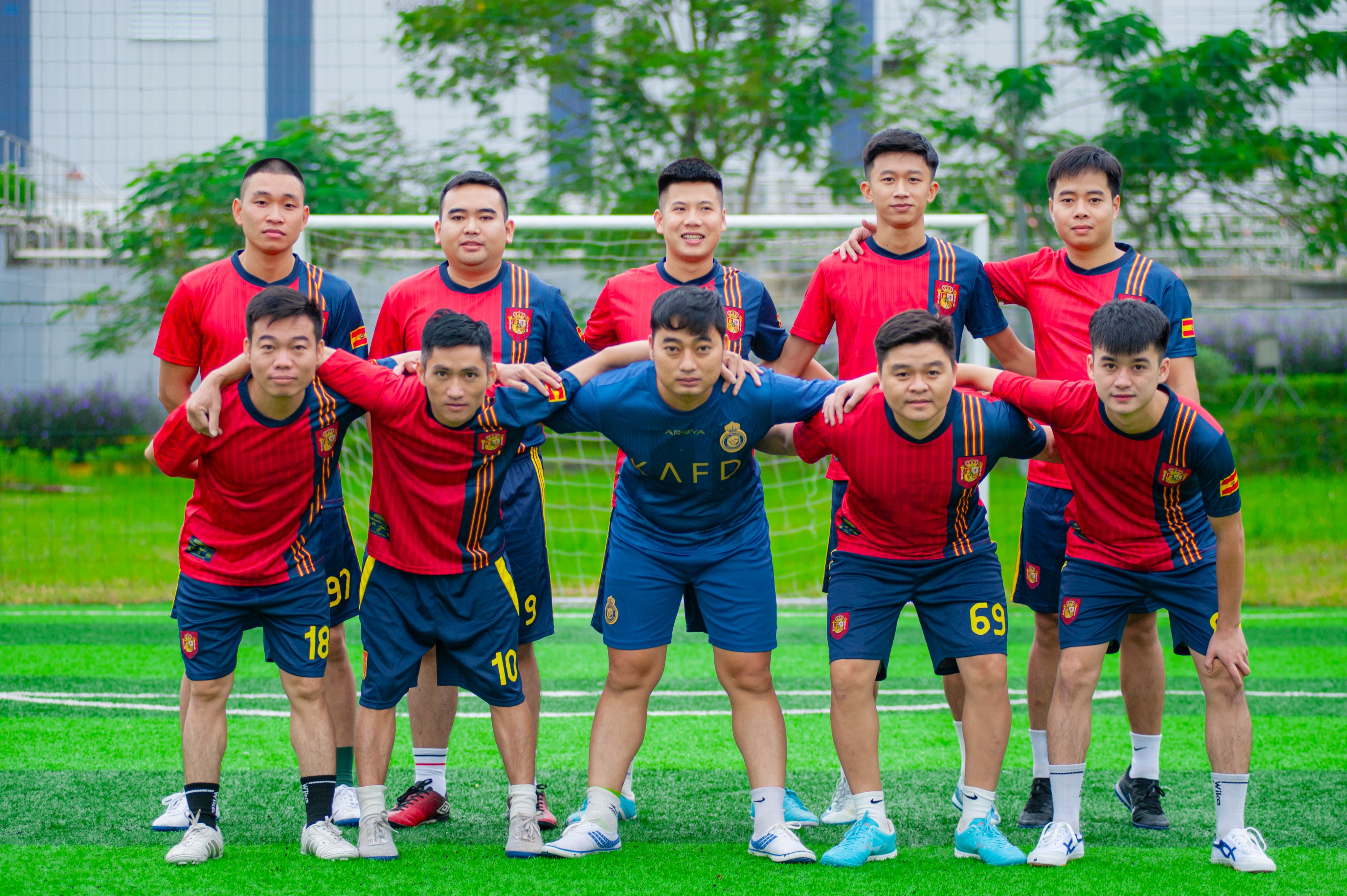 Soccer Team Posing on Outdoor Field in Hanoi · Free Stock Photo