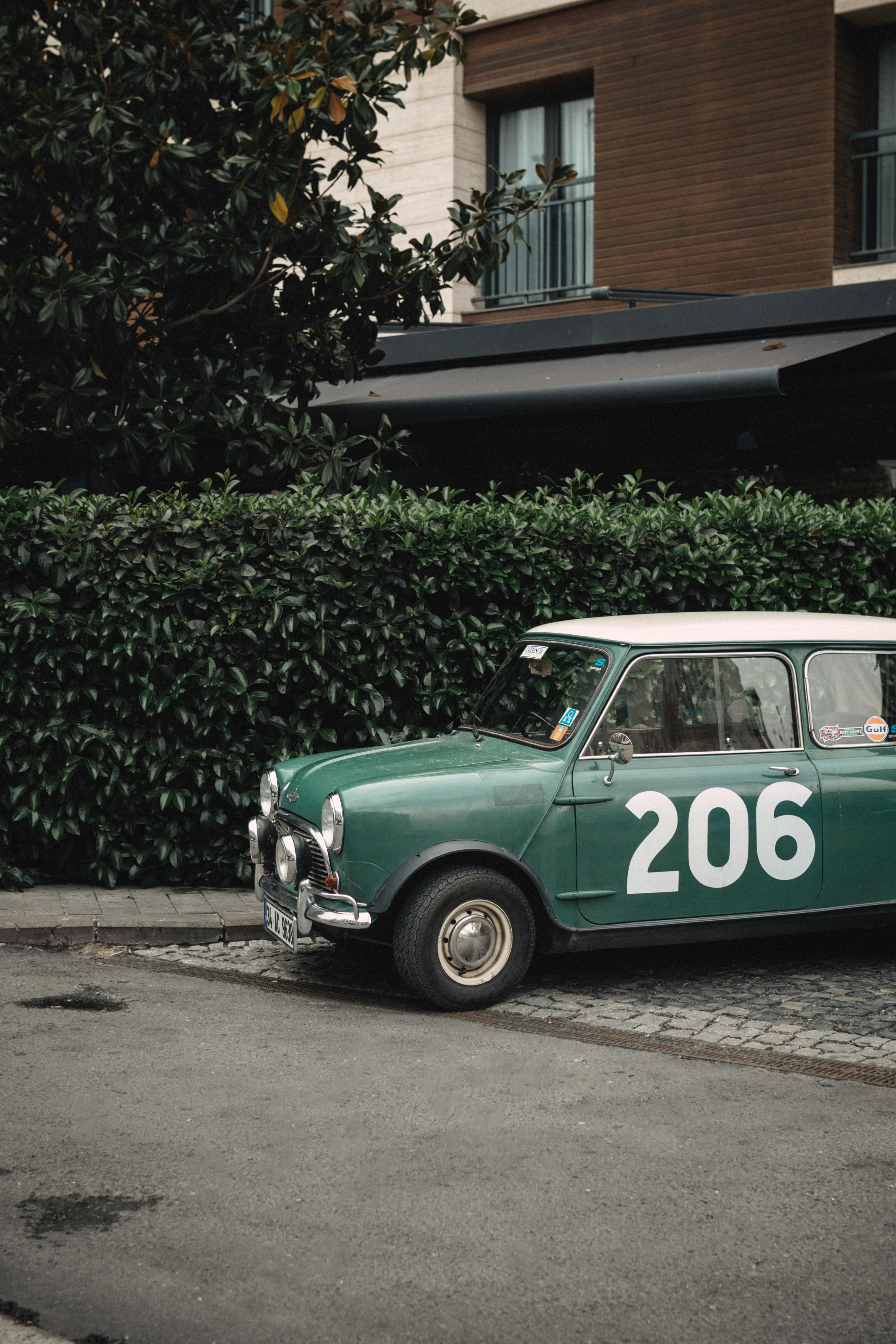 Vintage Green Mini Cooper Parked on Urban Street · Free Stock Photo