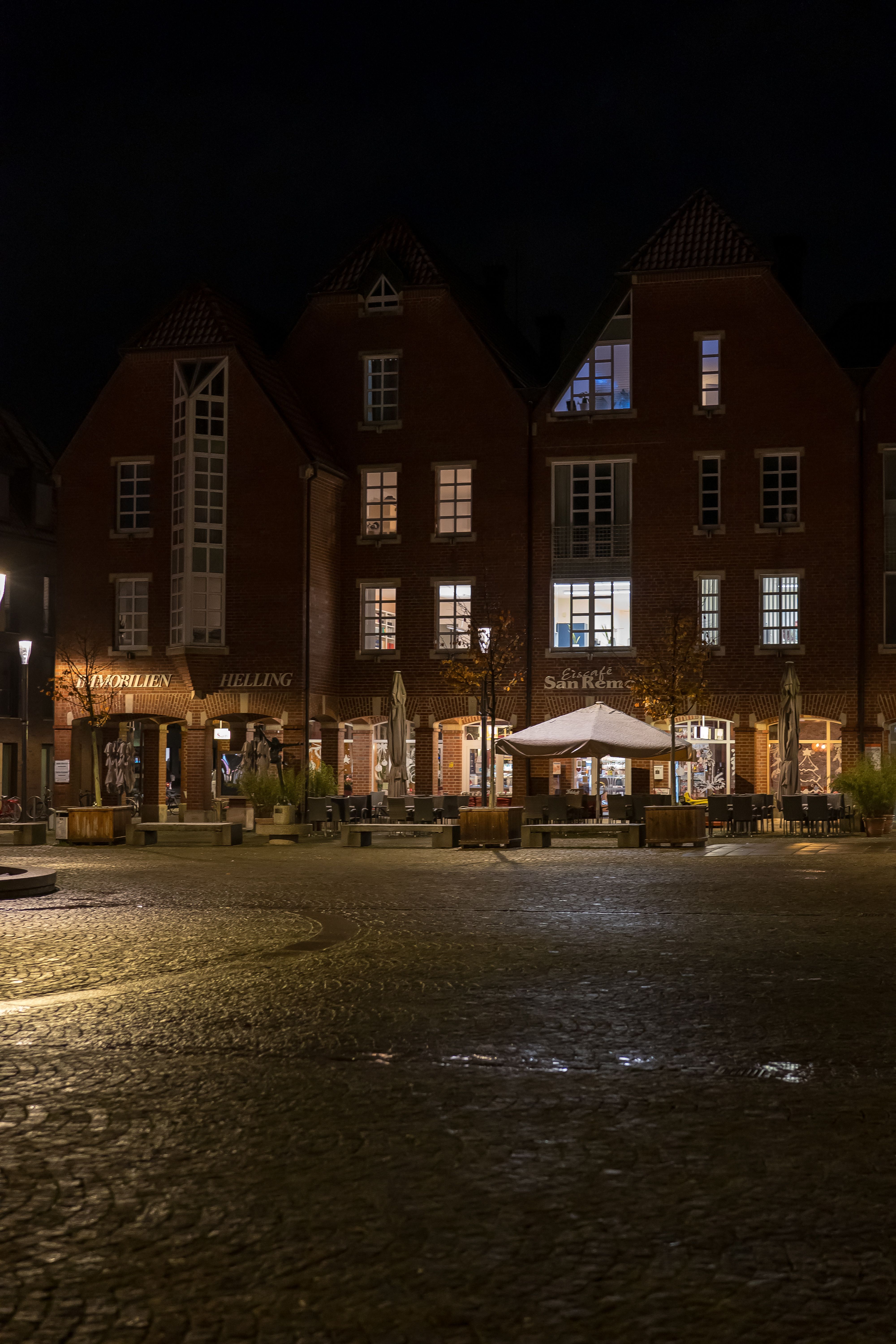 Charming Town Square with Brick Buildings at Night · Free Stock Photo