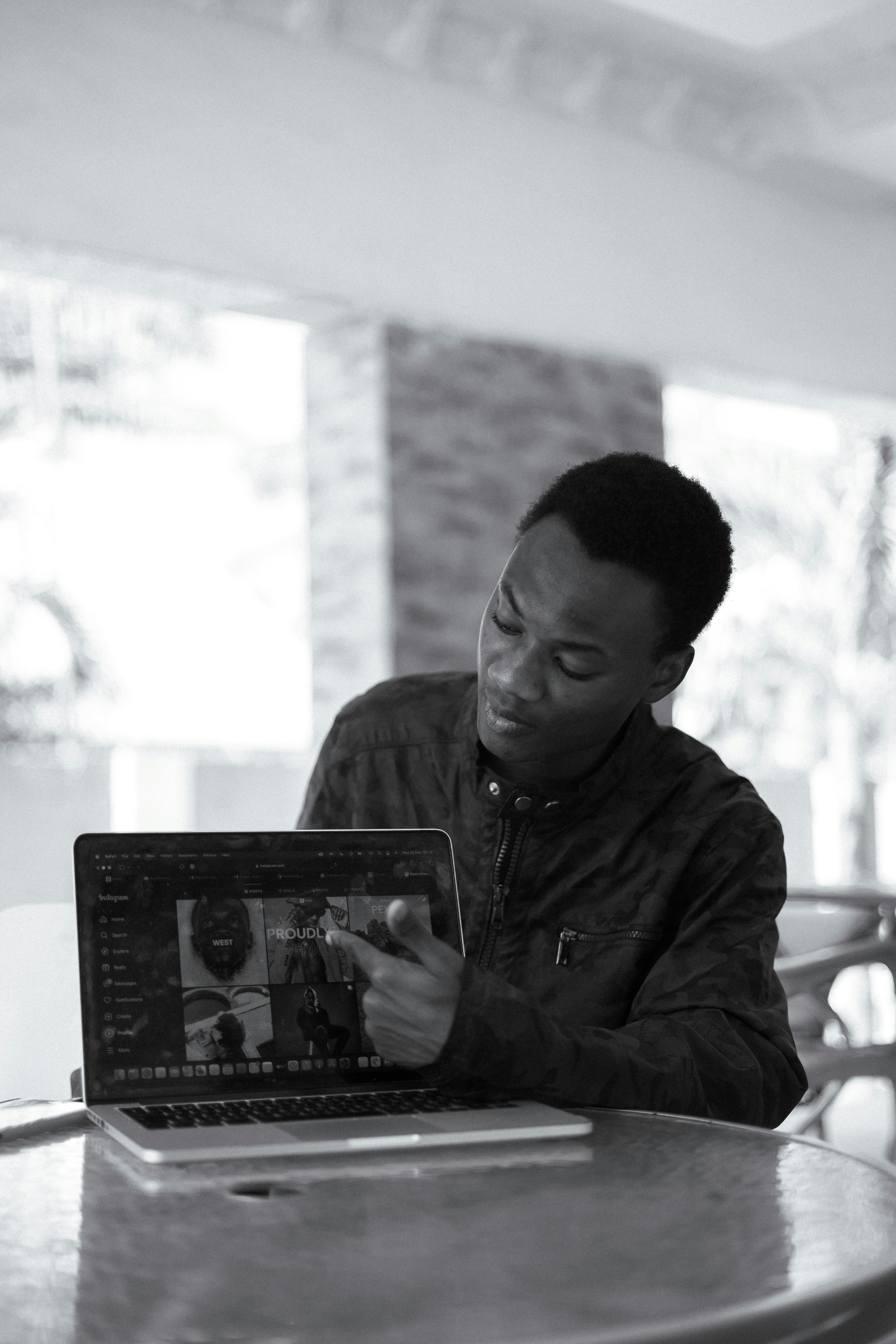 Man Using Laptop in Black and White Portrait · Free Stock Photo