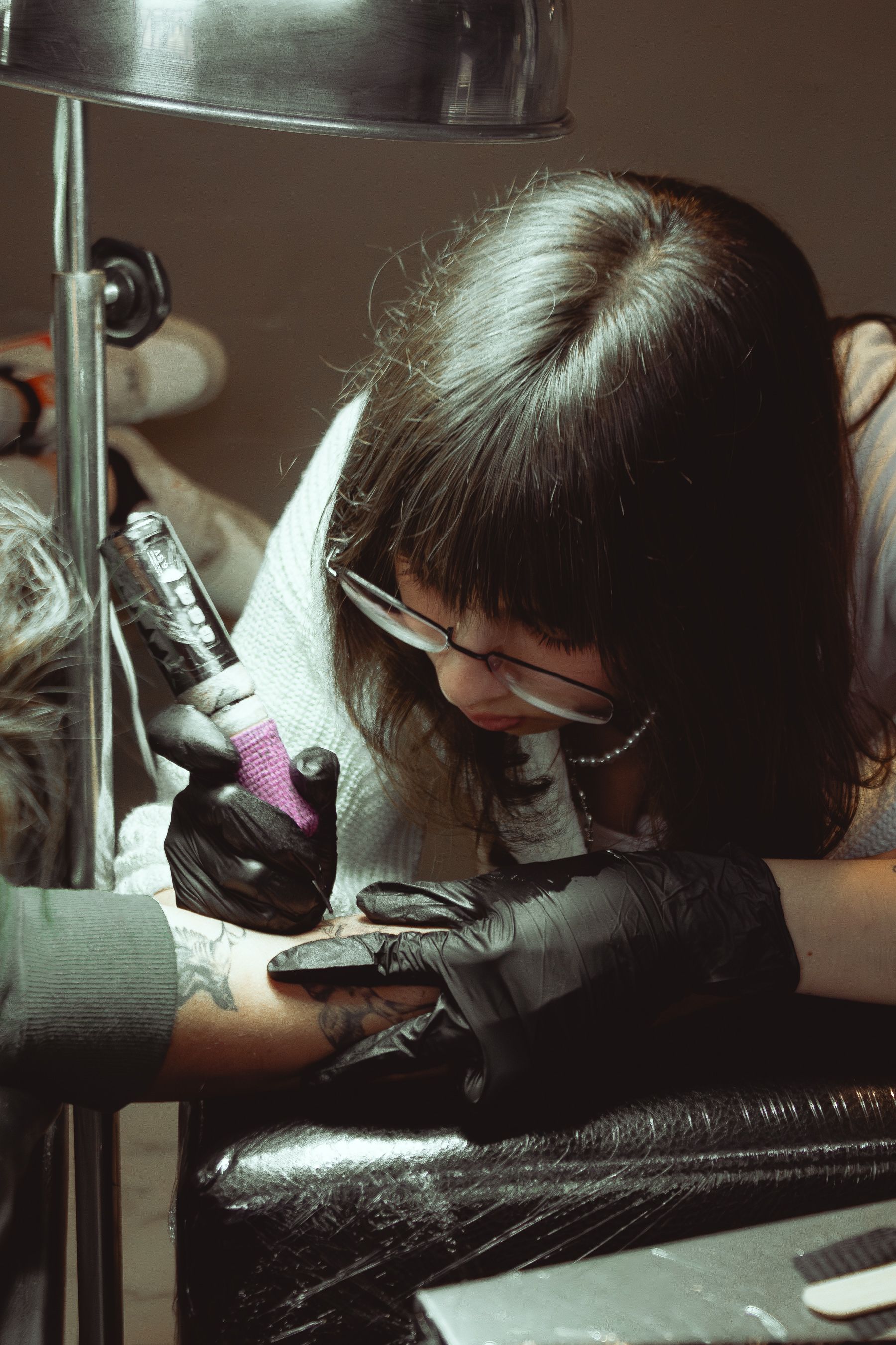Tattoo Artist Creating Detailed Arm Design · Free Stock Photo