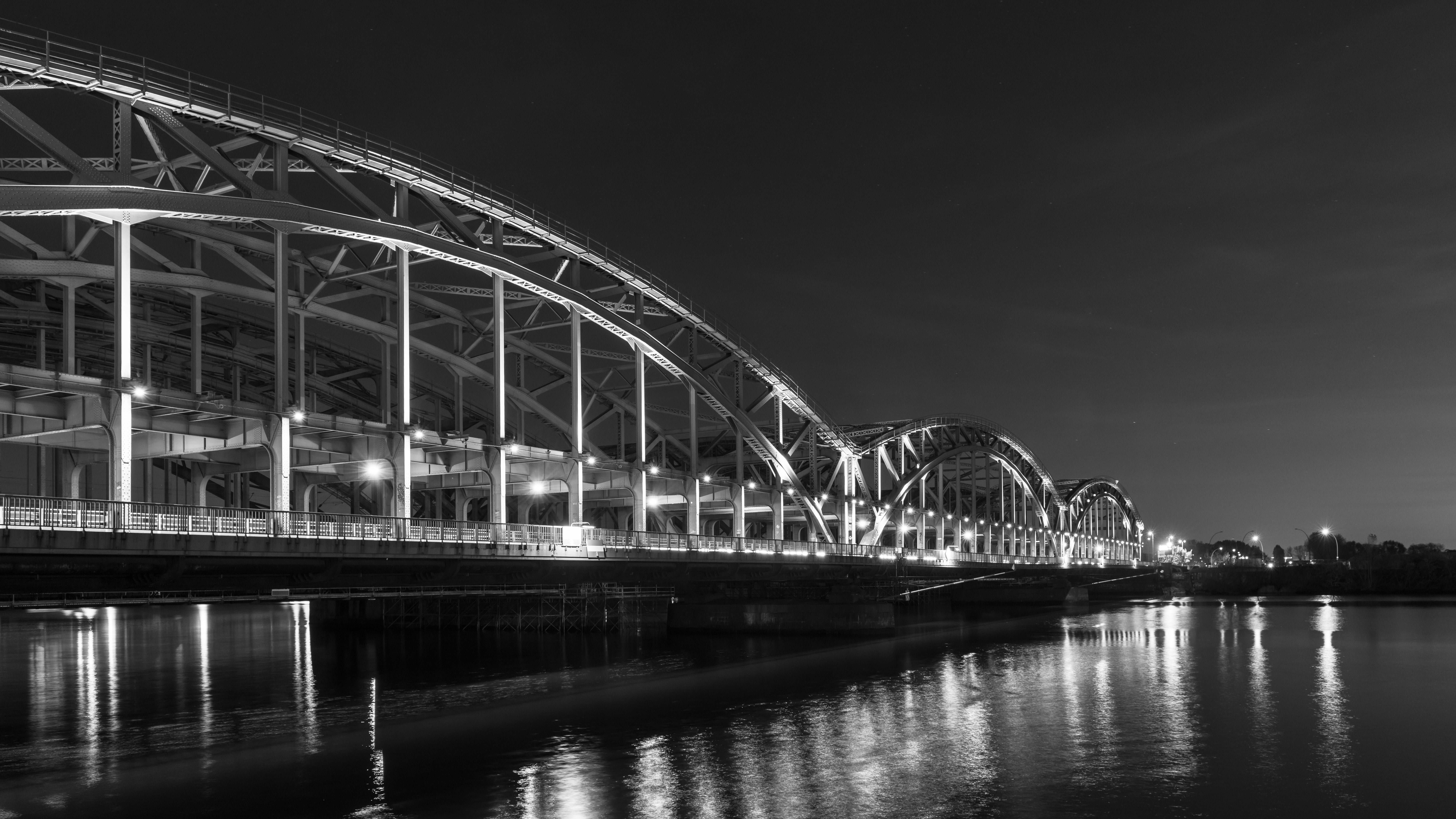 Illuminated Steel Bridge over River at Night · Free Stock Photo