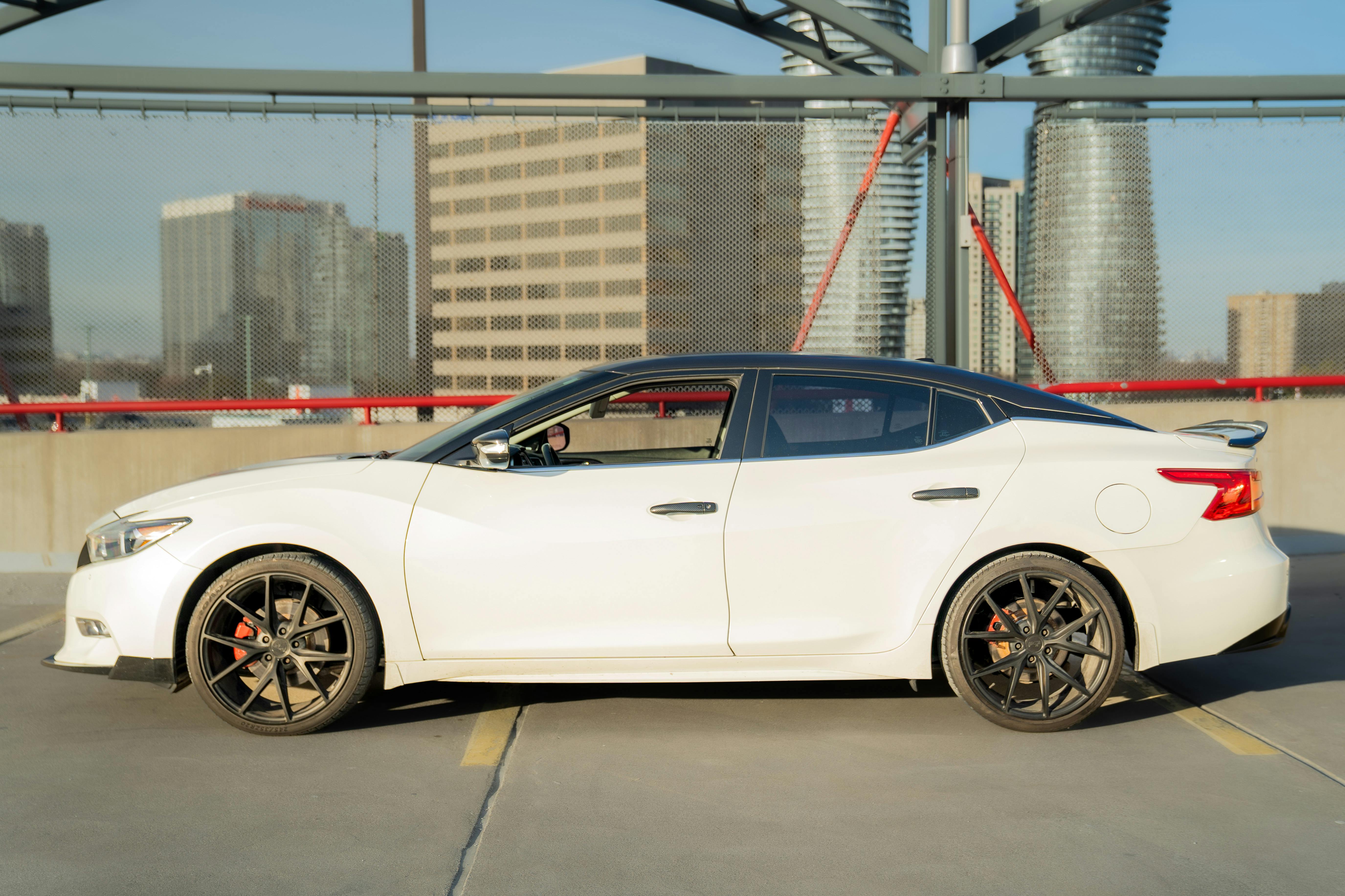 Stylish Nissan Maxima on Urban Rooftop · Free Stock Photo