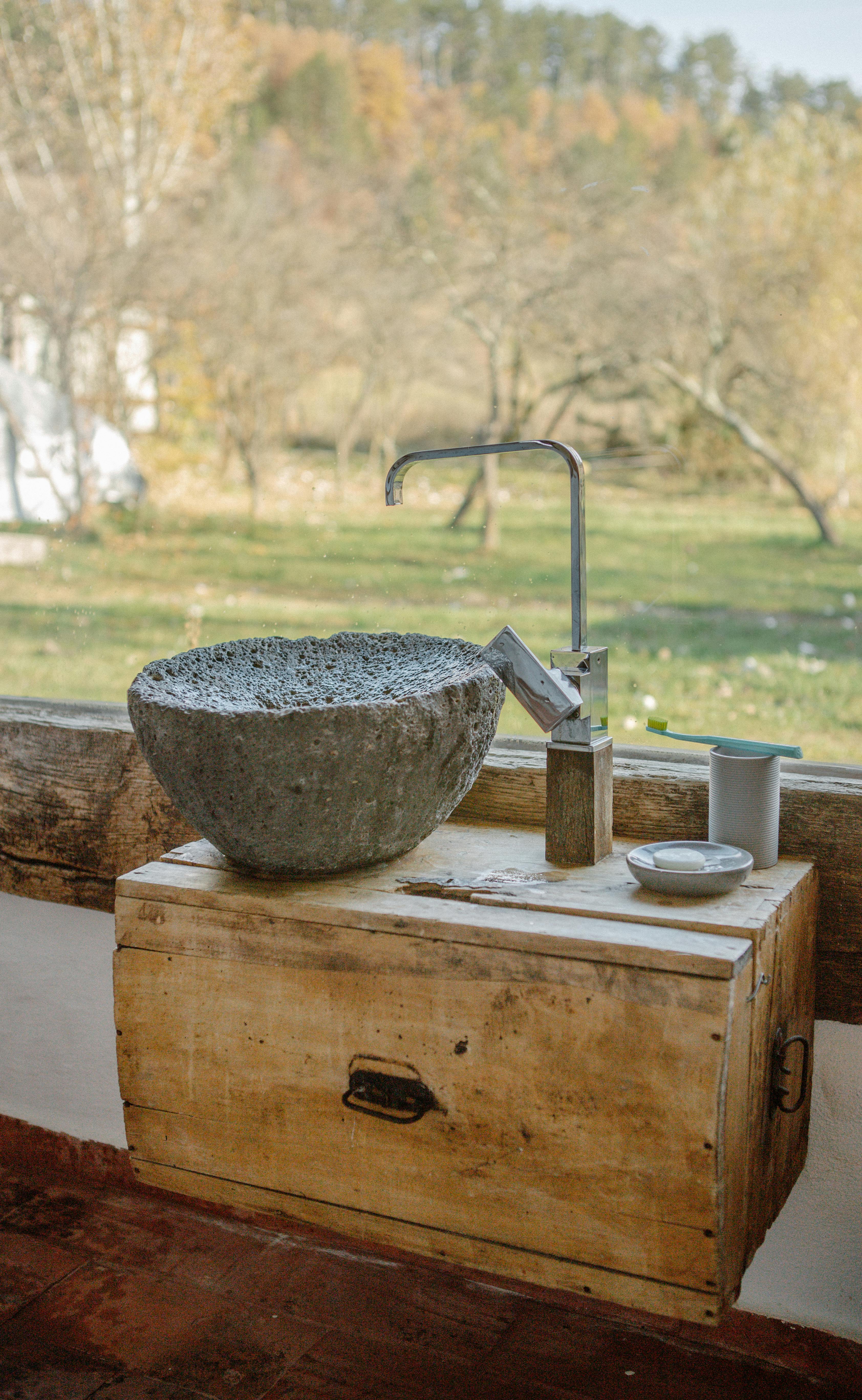 Rustic Stone Sink with Scenic Outdoor View · Free Stock Photo