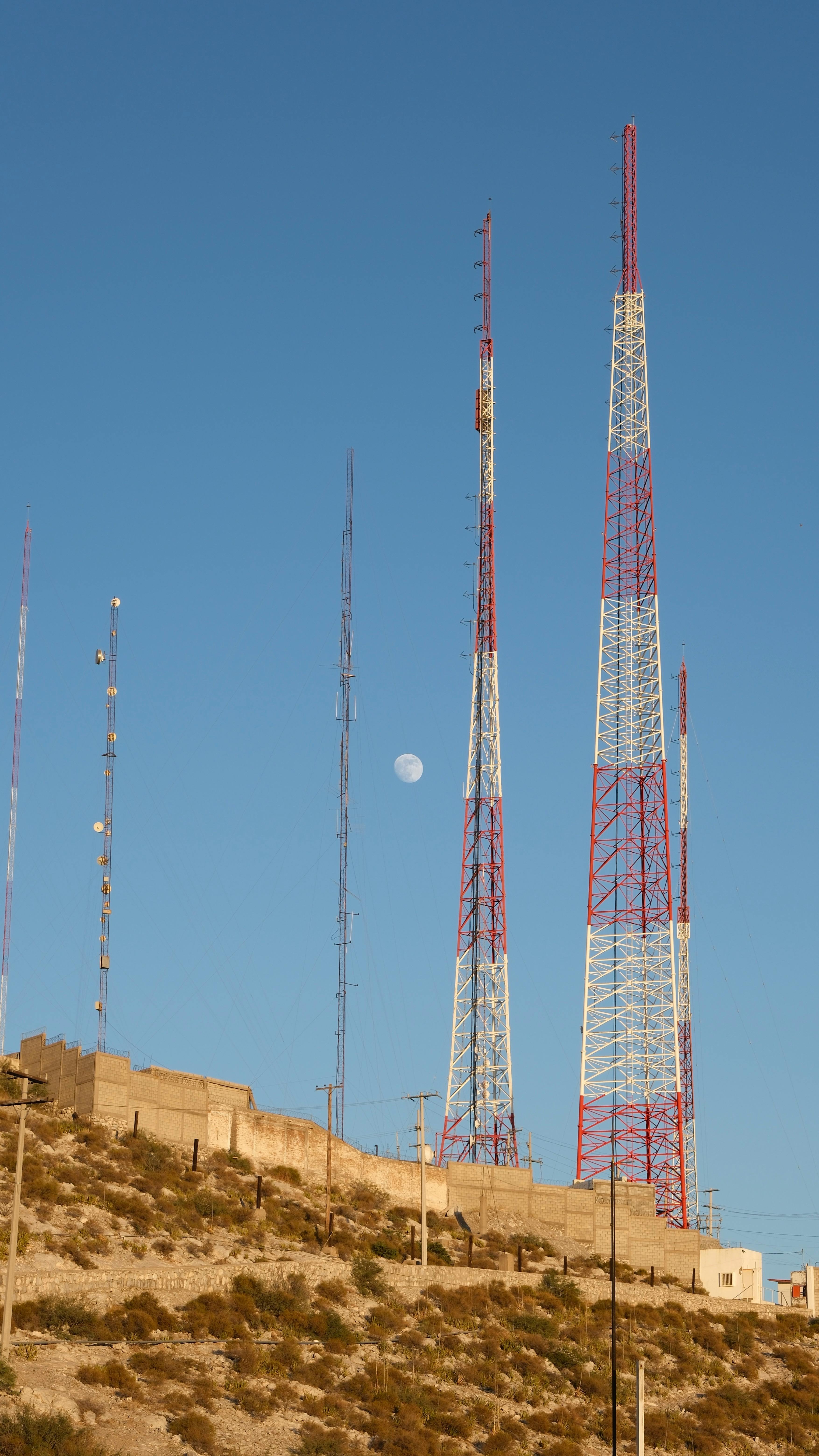 Tall Radio Towers Against Clear Blue Sky · Free Stock Photo