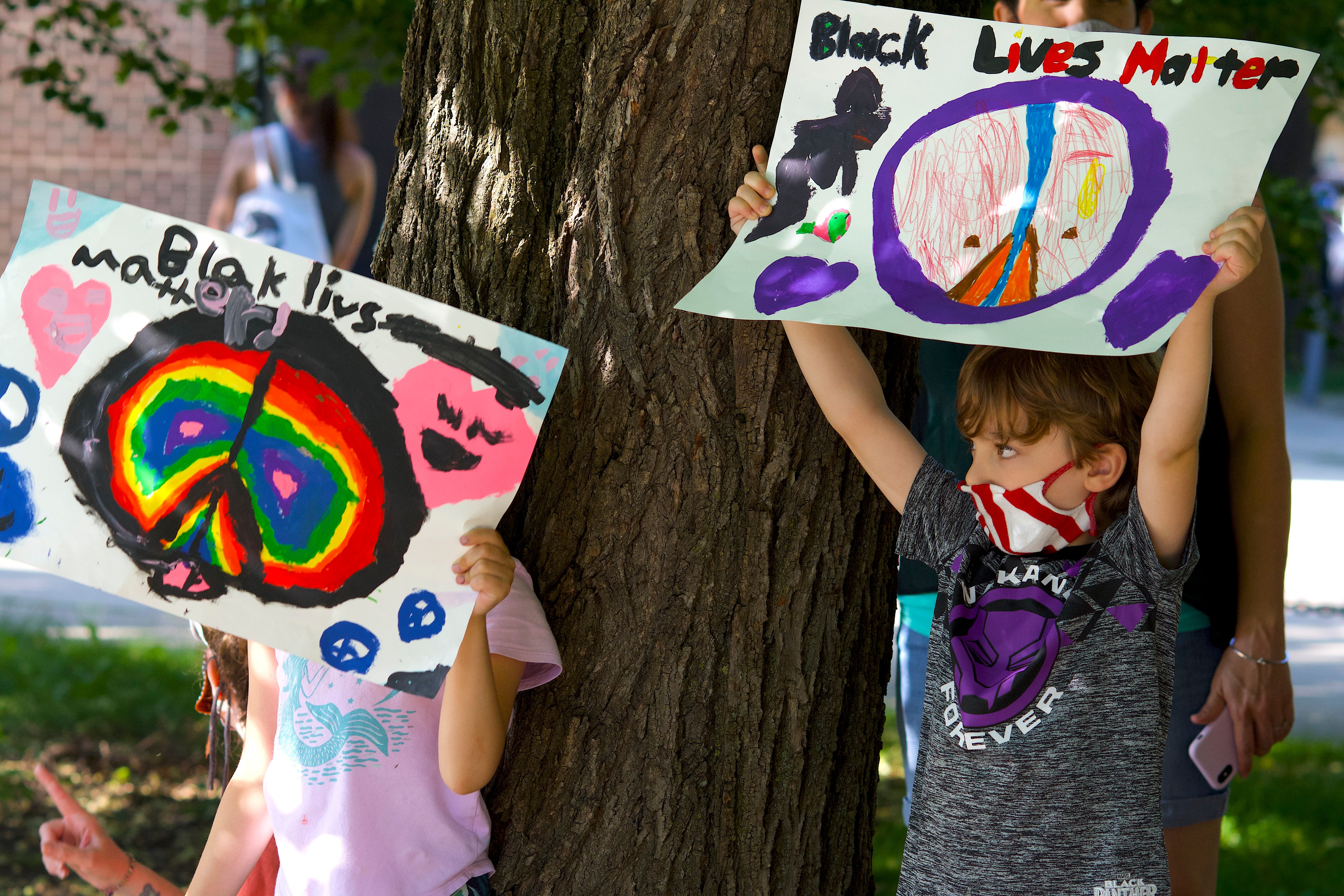 Children Holding Black Lives Matter Painted Signs Outdoors · Free Stock ...