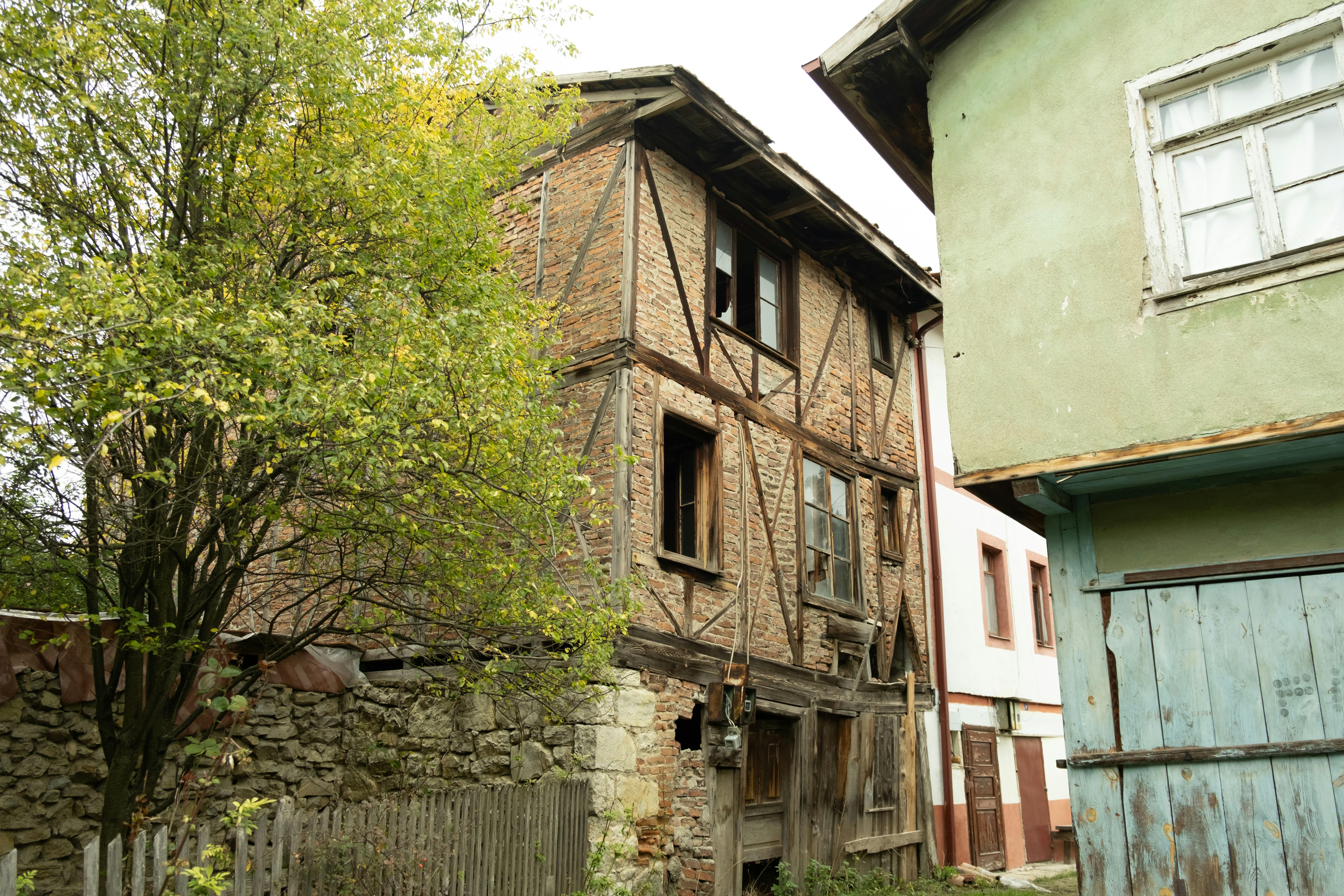 Old Rustic House in Quaint Village Setting · Free Stock Photo