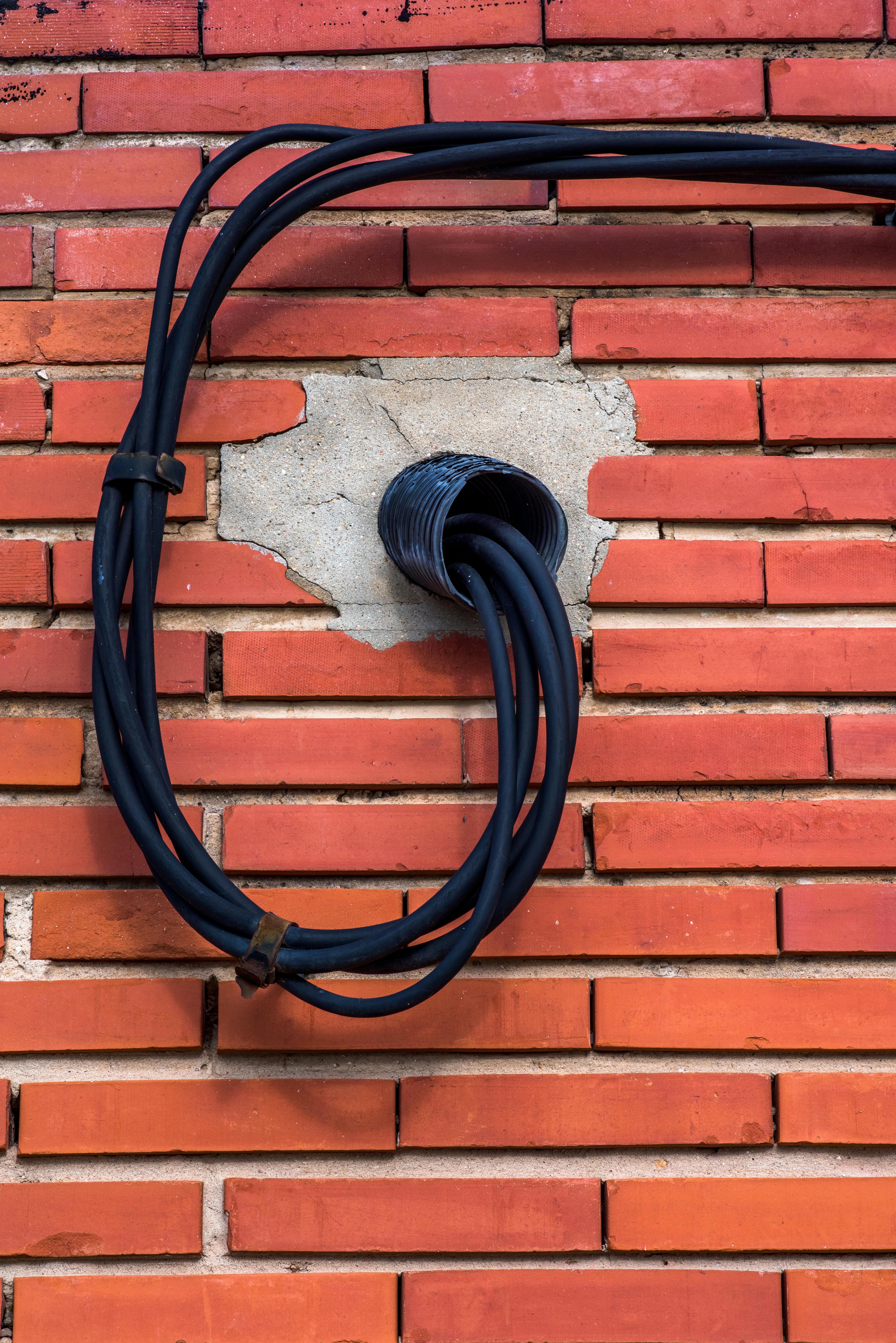 Cable Wires Coming Out from a Hole · Free Stock Photo