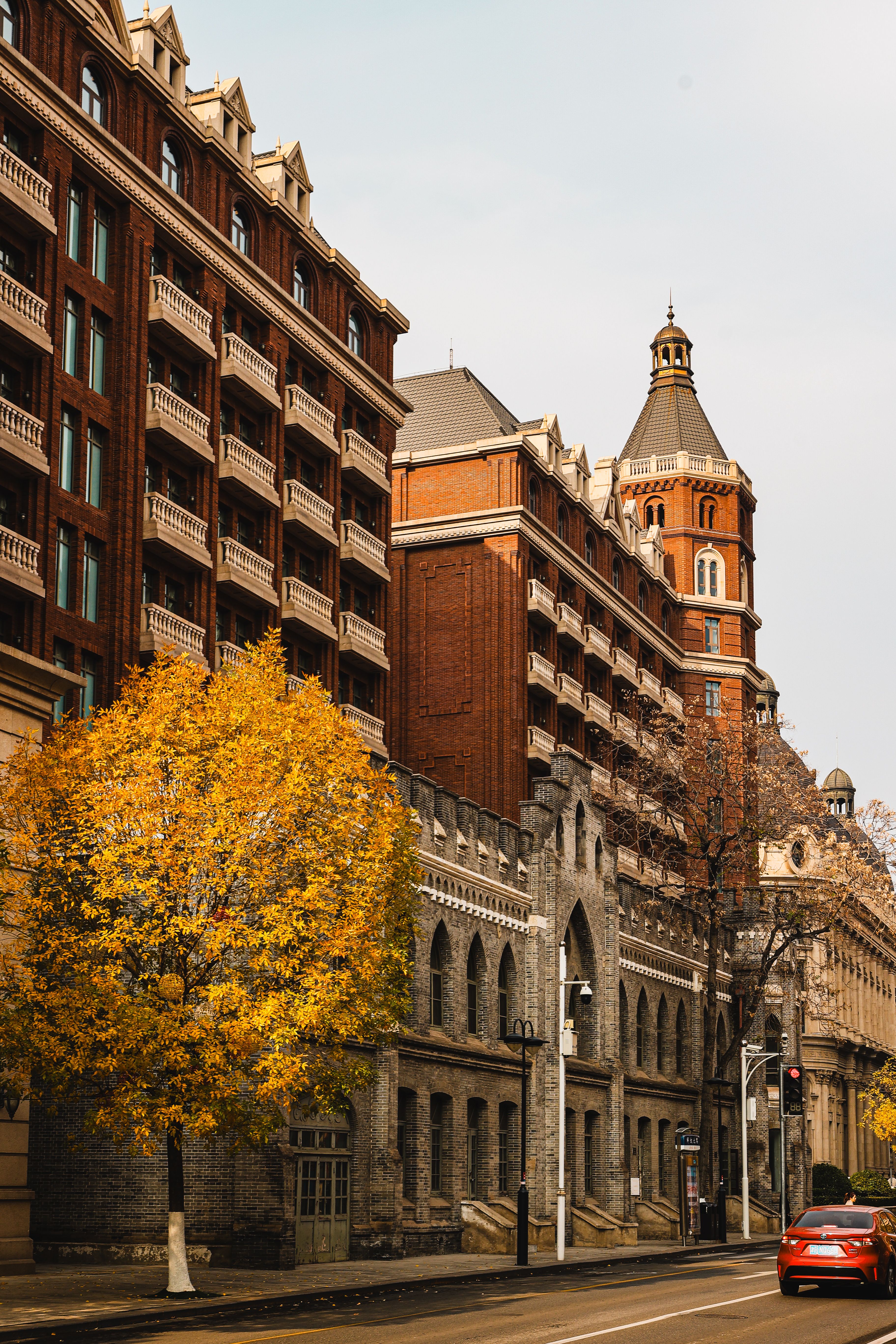 Historic Brick Architecture in Autumn · Free Stock Photo