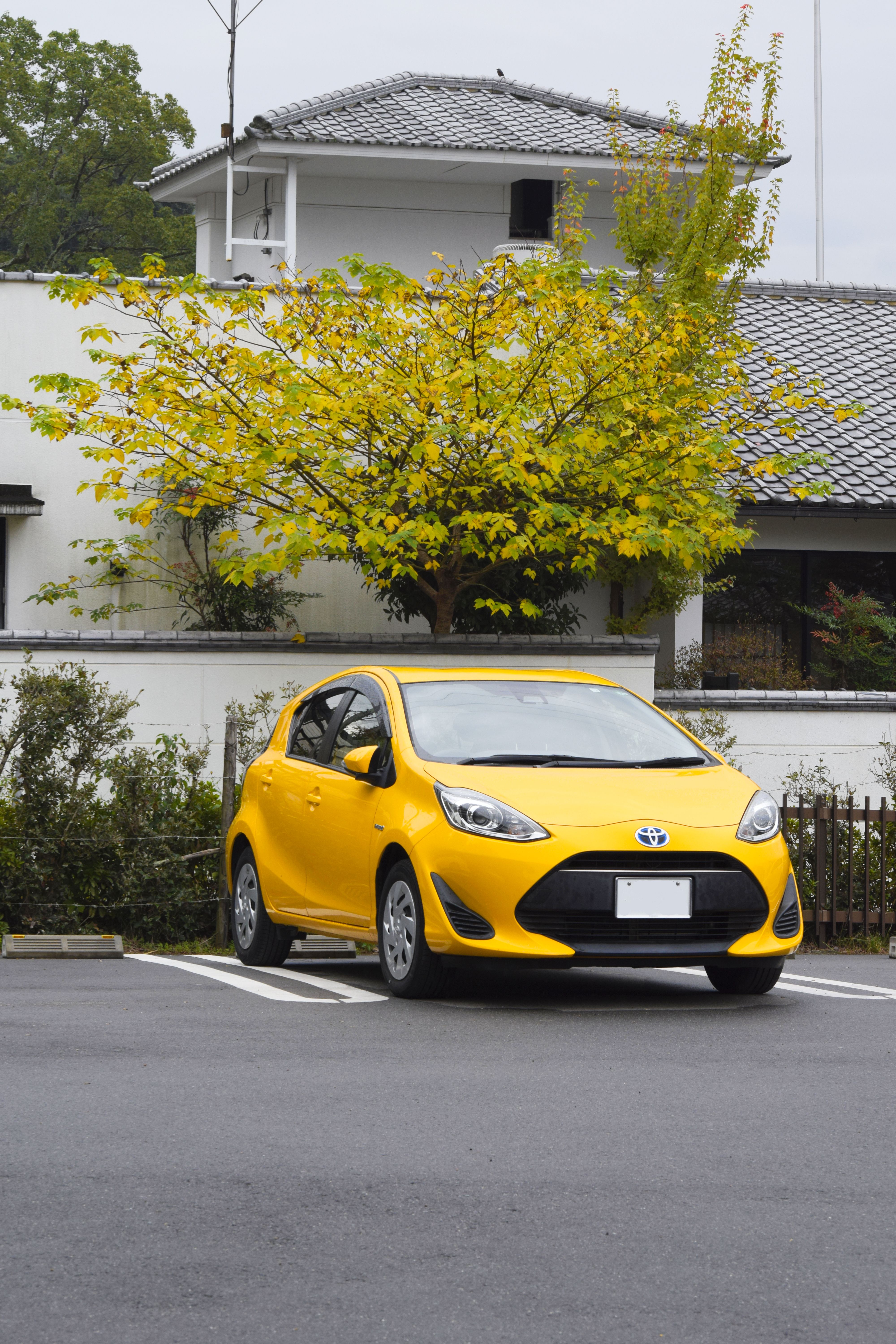 Bright Yellow Car in Uji, Kyoto Parking Lot · Free Stock Photo