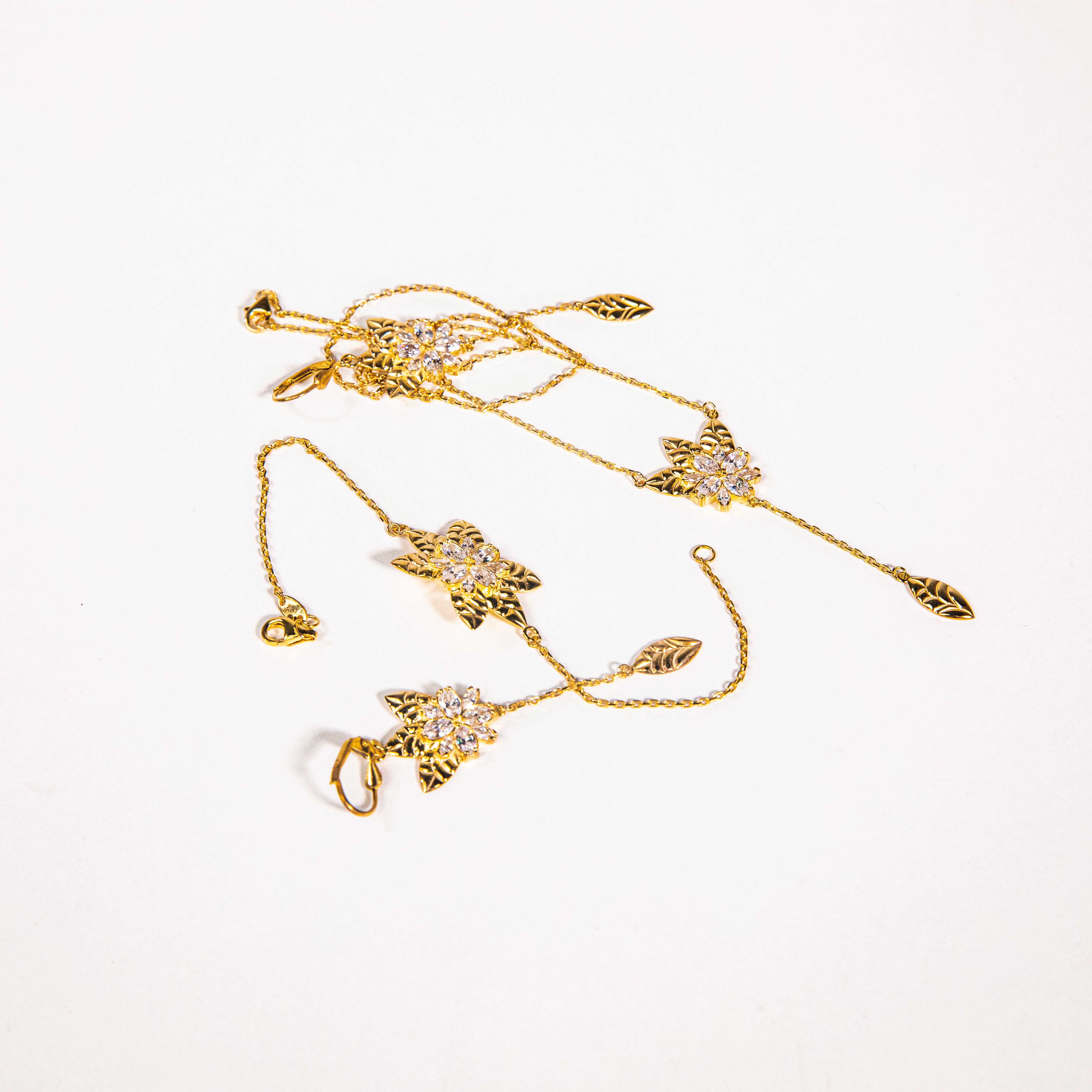 Elegant Gold and Crystal Leaf Design Bracelet · Free Stock Photo