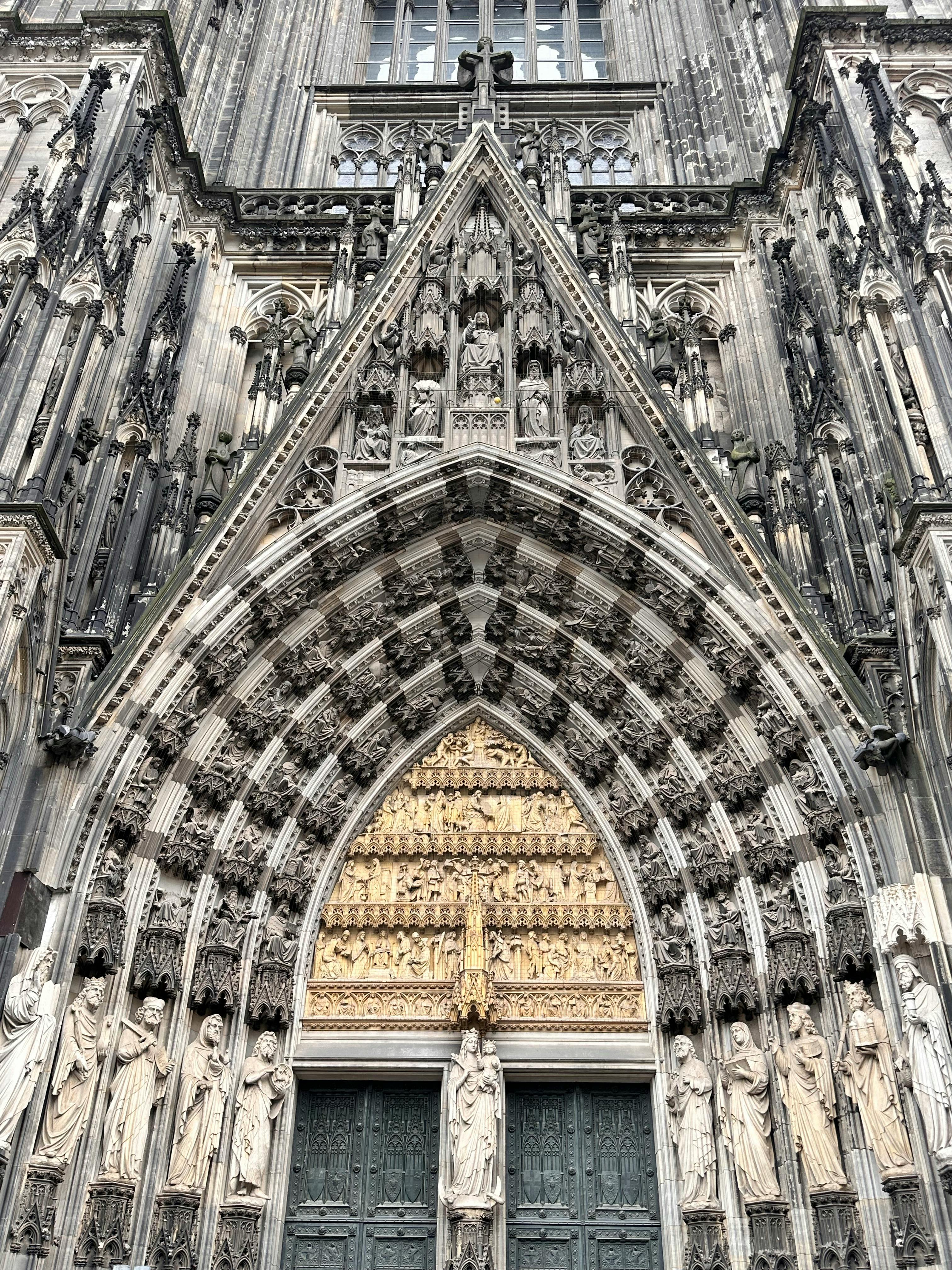 Gothic Cathedral Entrance with Detailed Sculptures · Free Stock Photo