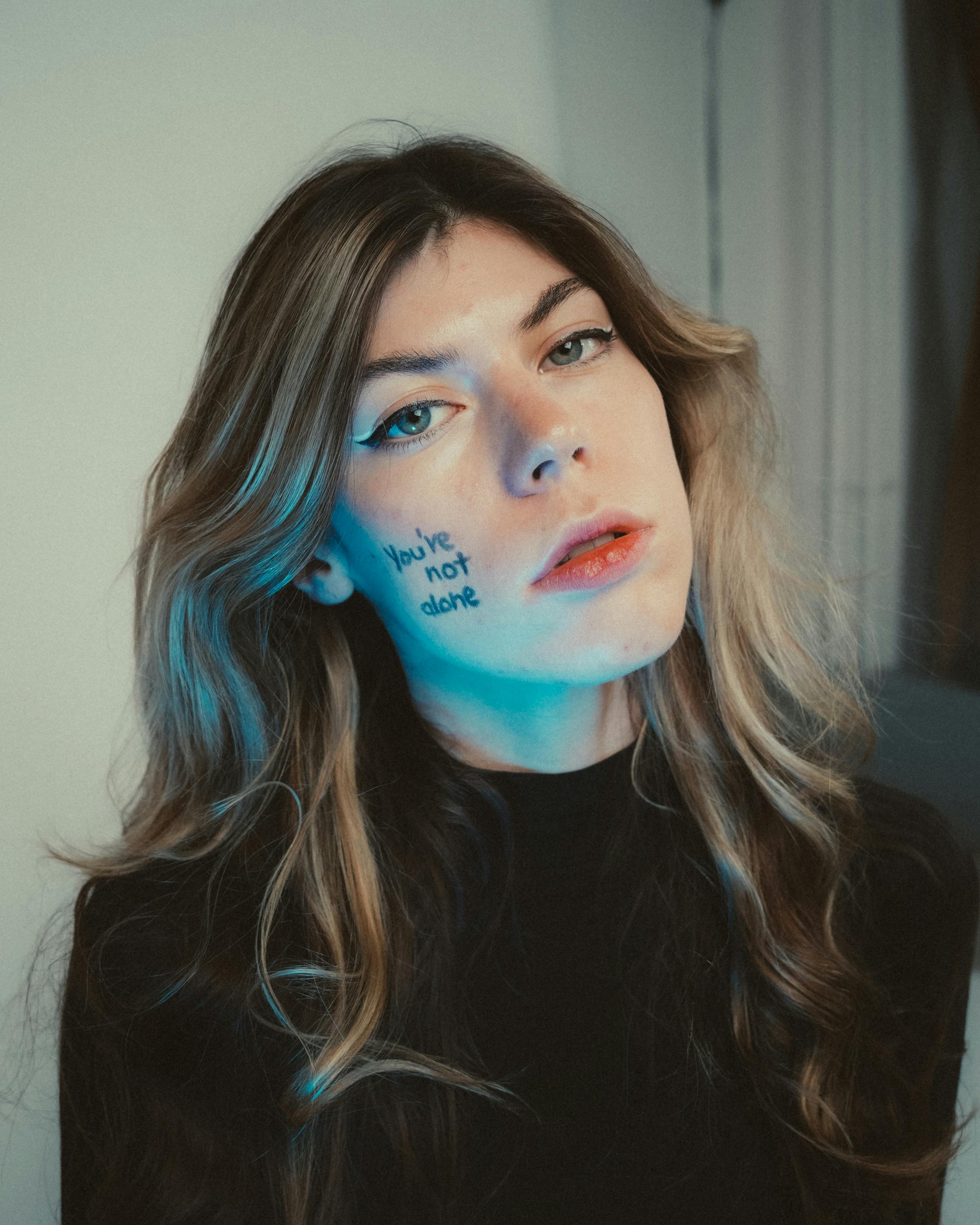 Portrait of Woman with Inspirational Message on Cheek · Free Stock Photo