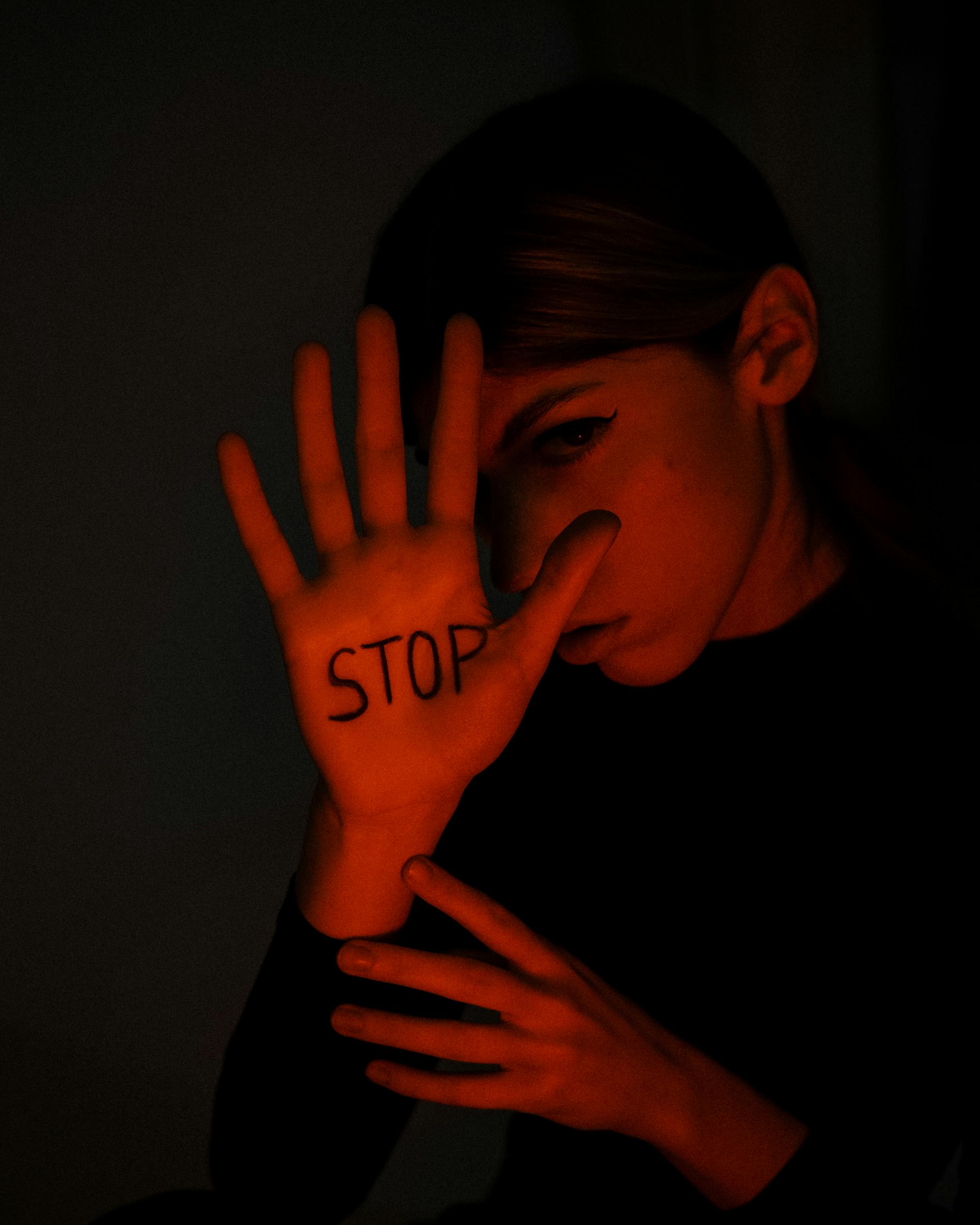 Dramatic Portrait with STOP on Hand · Free Stock Photo