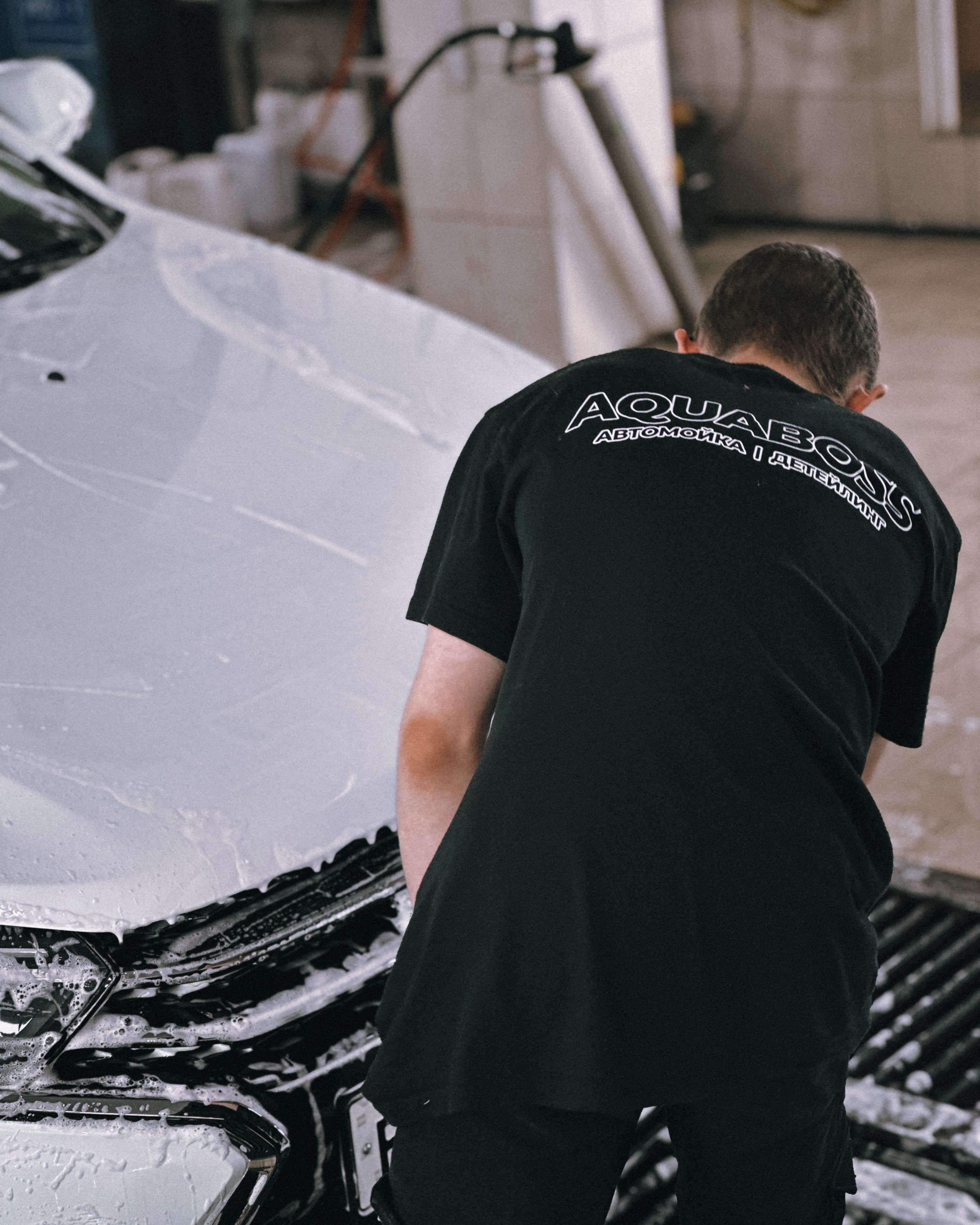 Car Detailing Professional at Work in Garage · Free Stock Photo