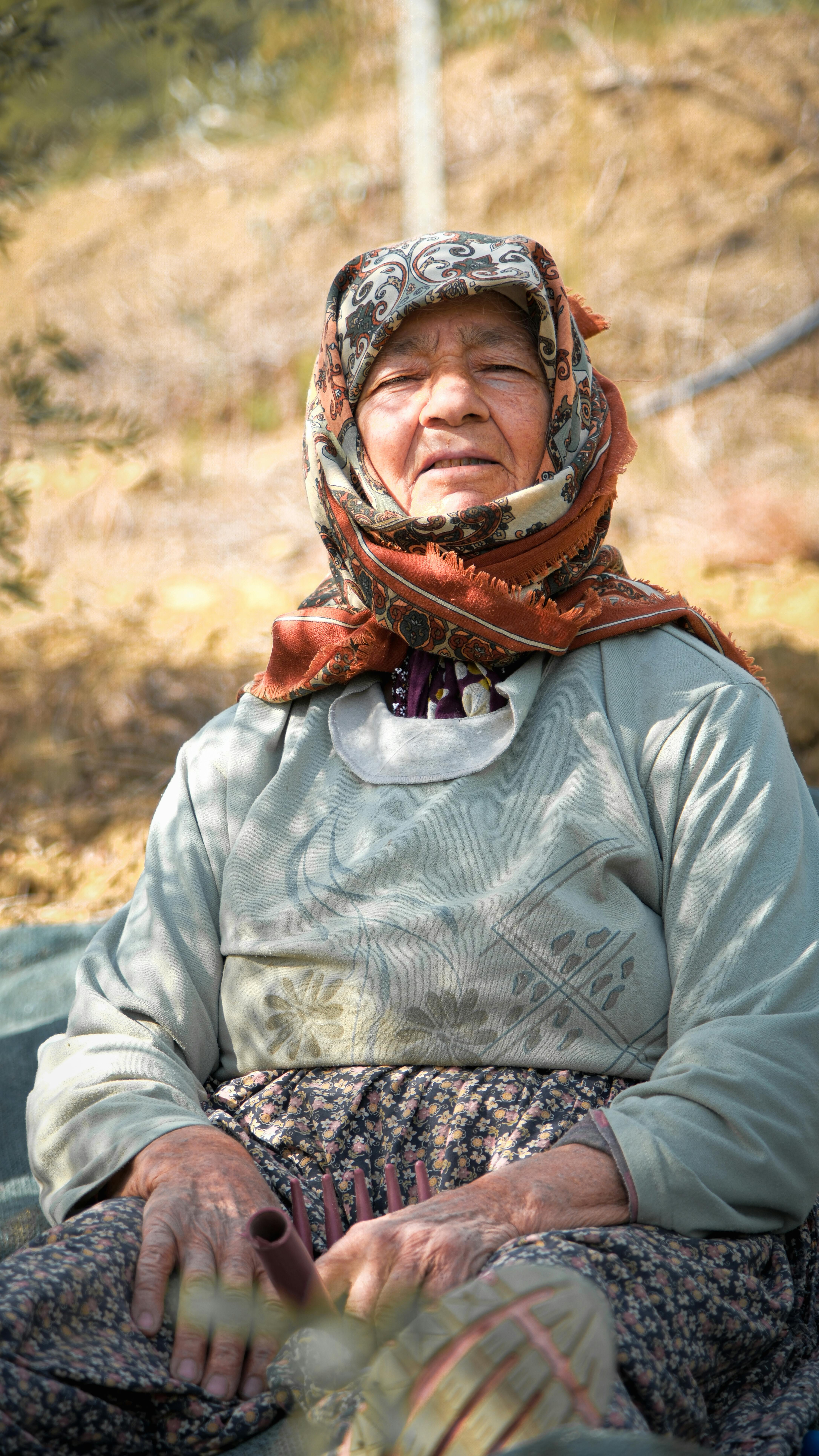 Portrait of Elderly Woman in Traditional Scarf · Free Stock Photo