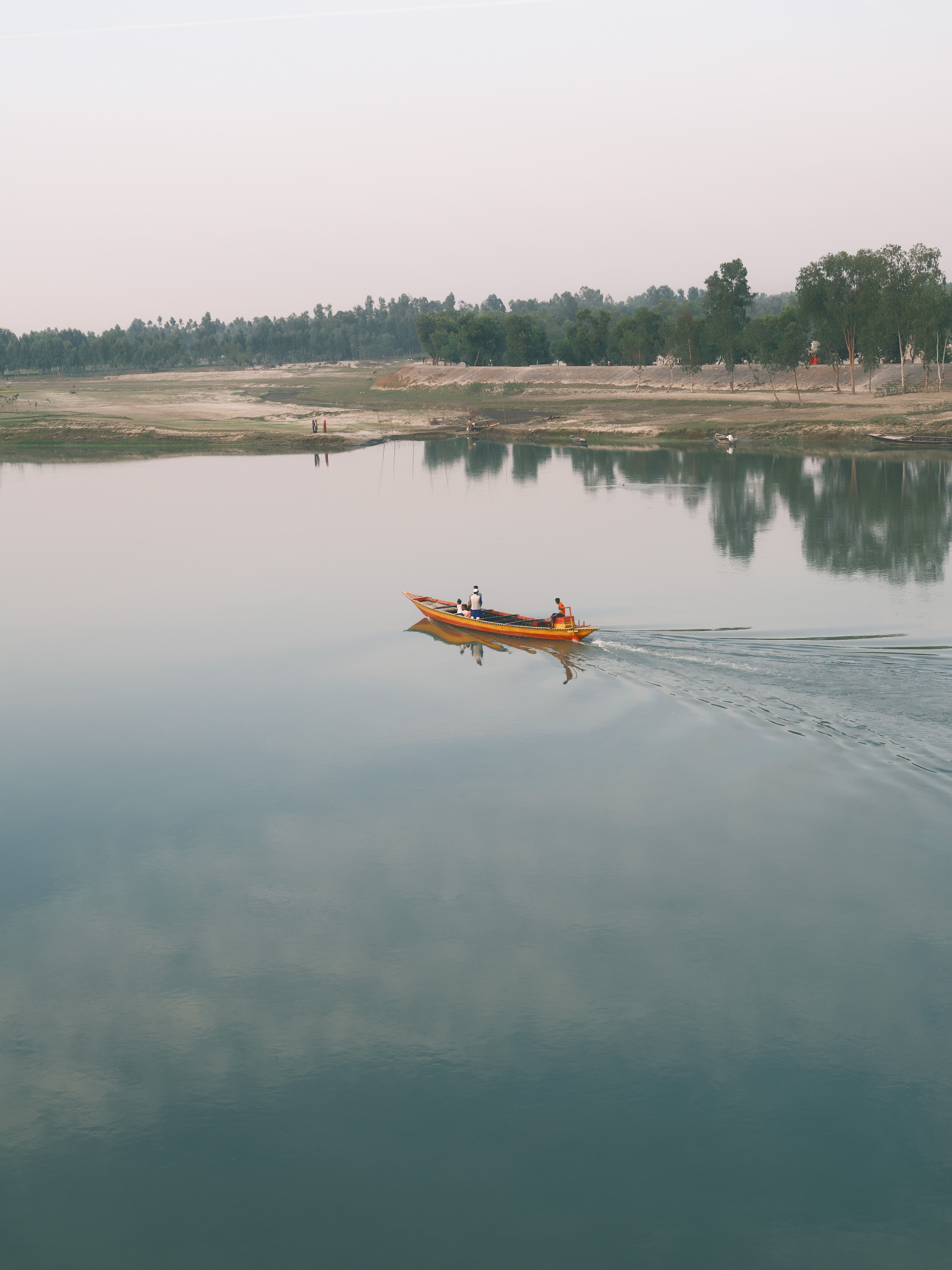 Tranquil Boat Ride on a Serene Lake · Free Stock Photo