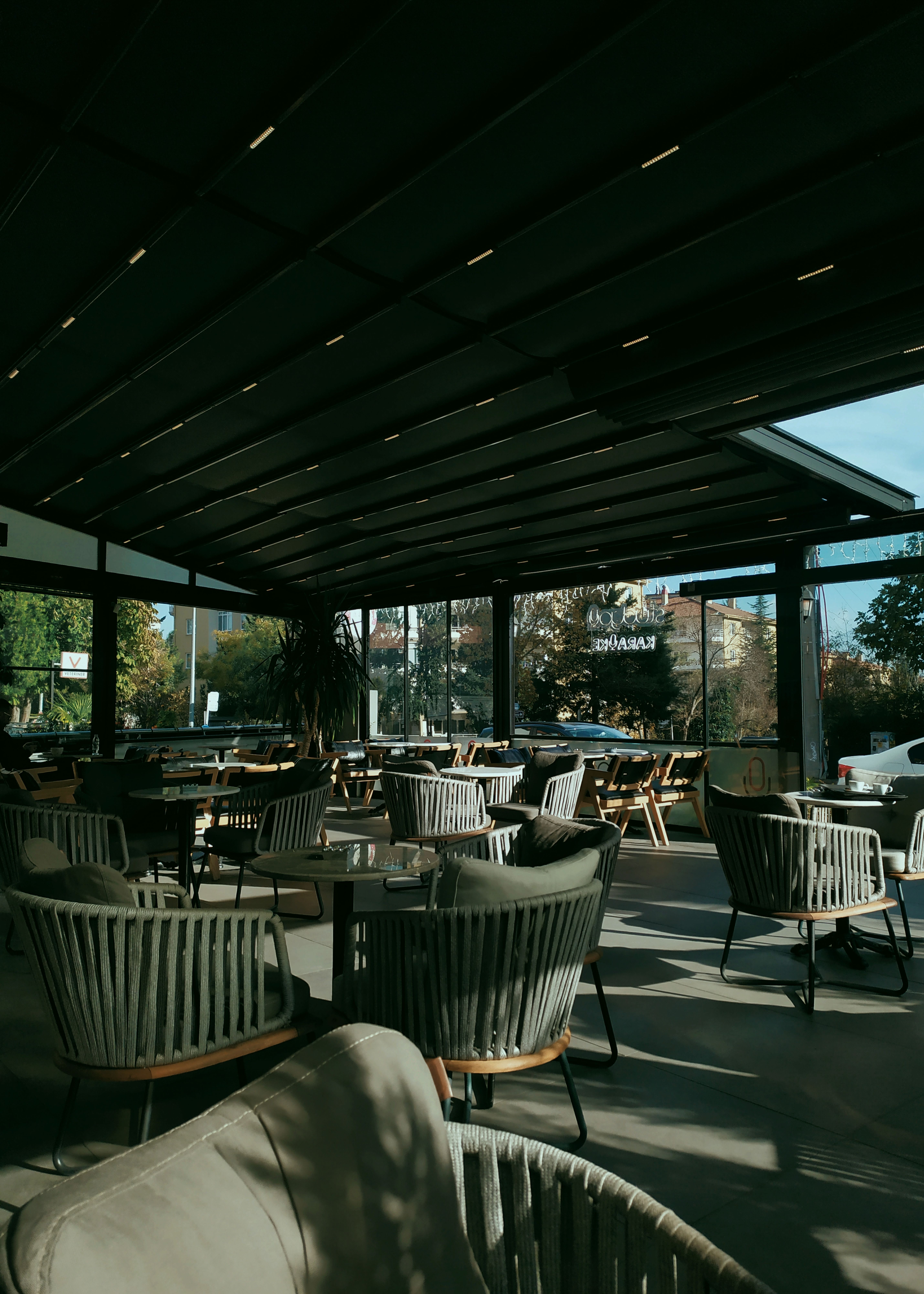 Modern Outdoor Cafe with Stylish Seating · Free Stock Photo
