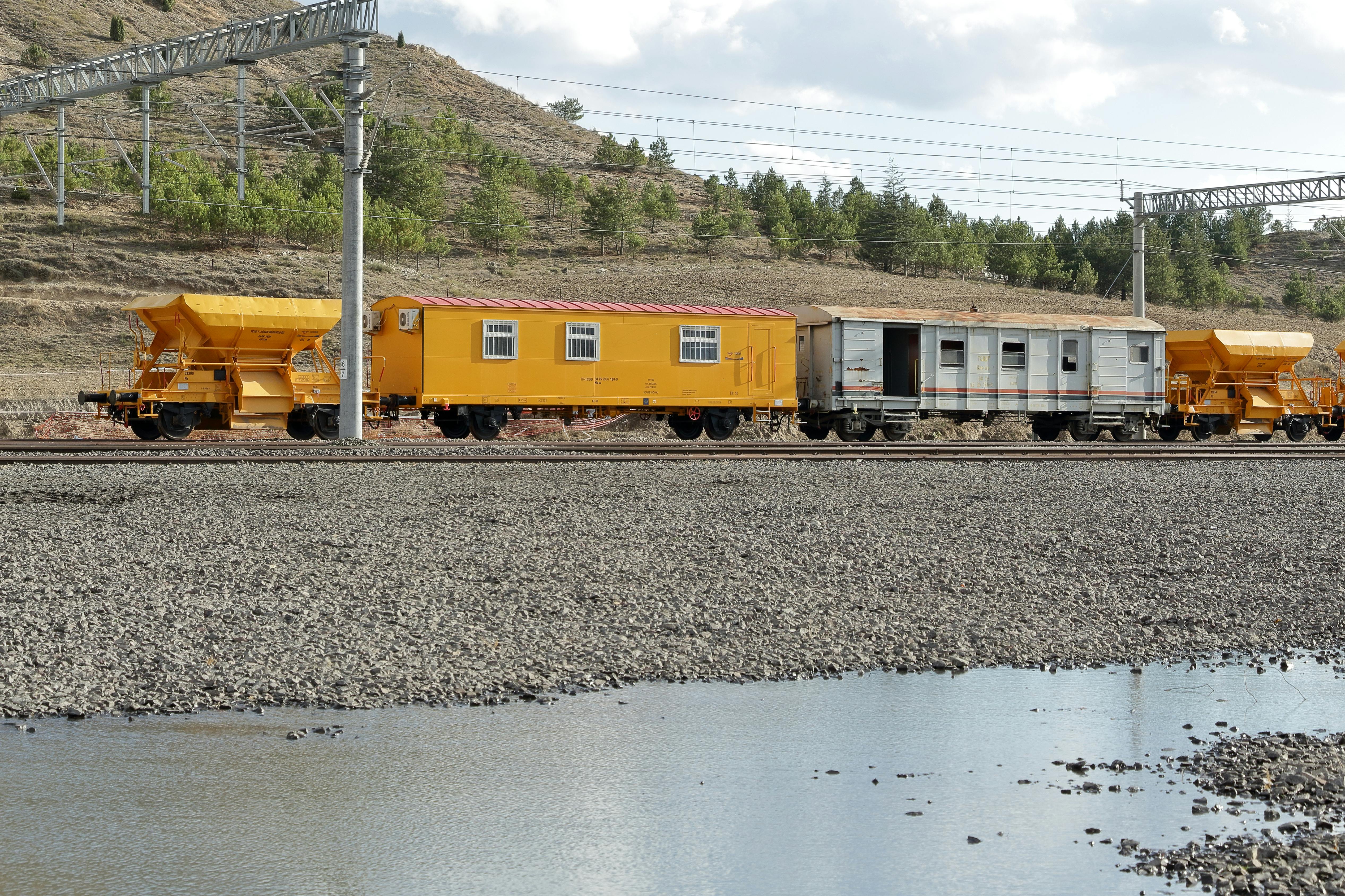 Industrial Train Passing Through Scenic Countryside · Free Stock Photo