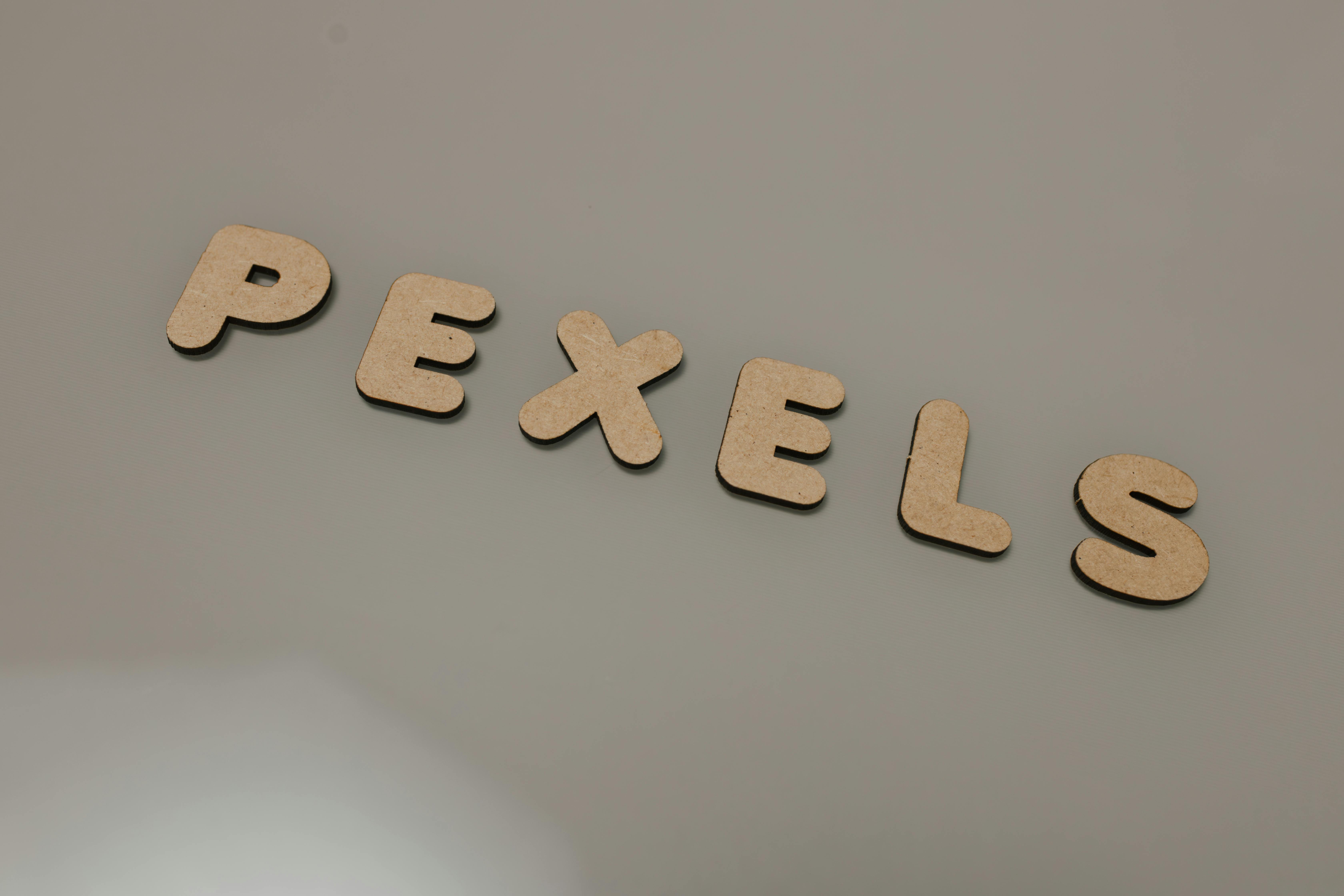 Pexels Wooden Letters on Neutral Background · Free Stock Photo