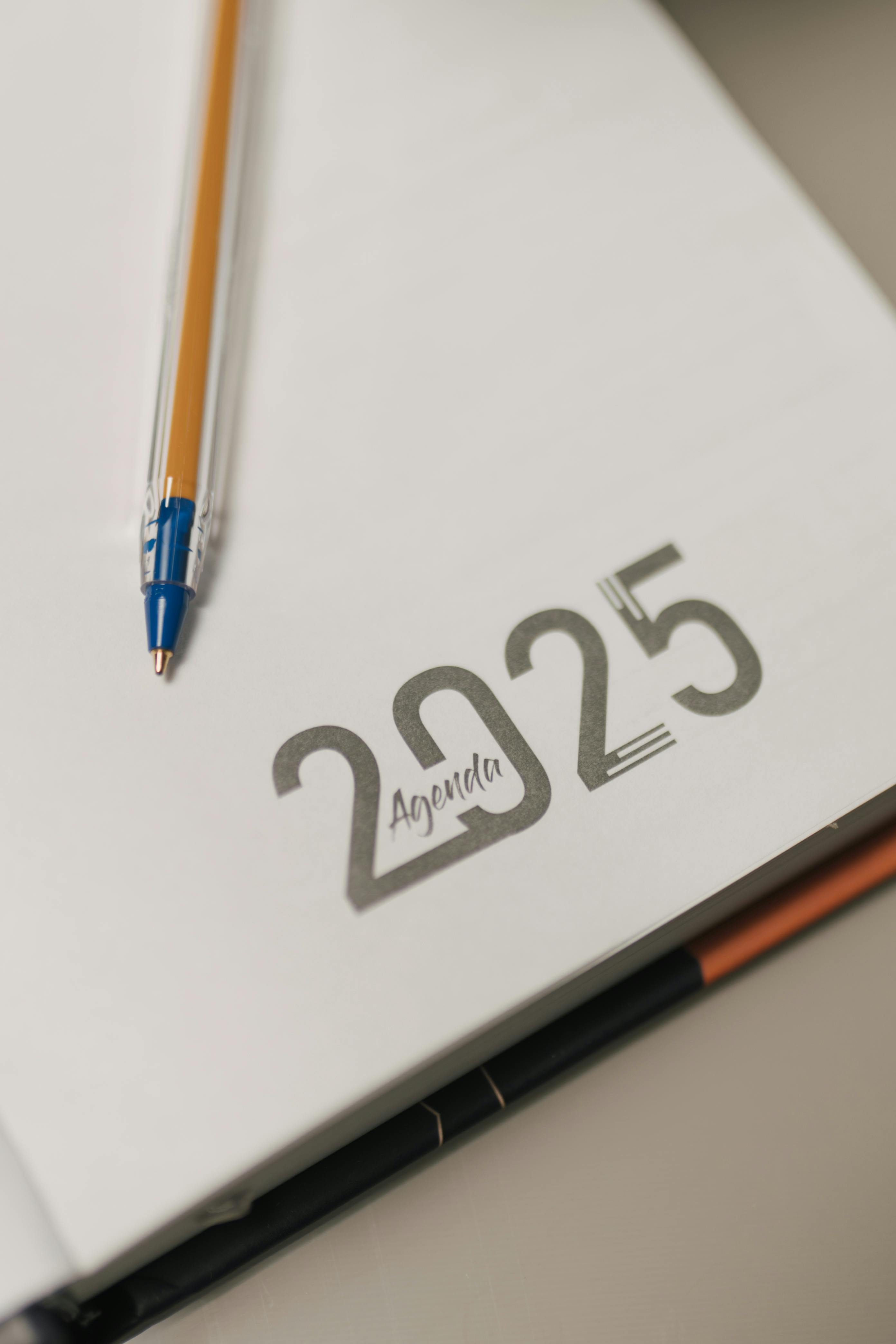 2025 Planner with Pen on Desktop · Free Stock Photo