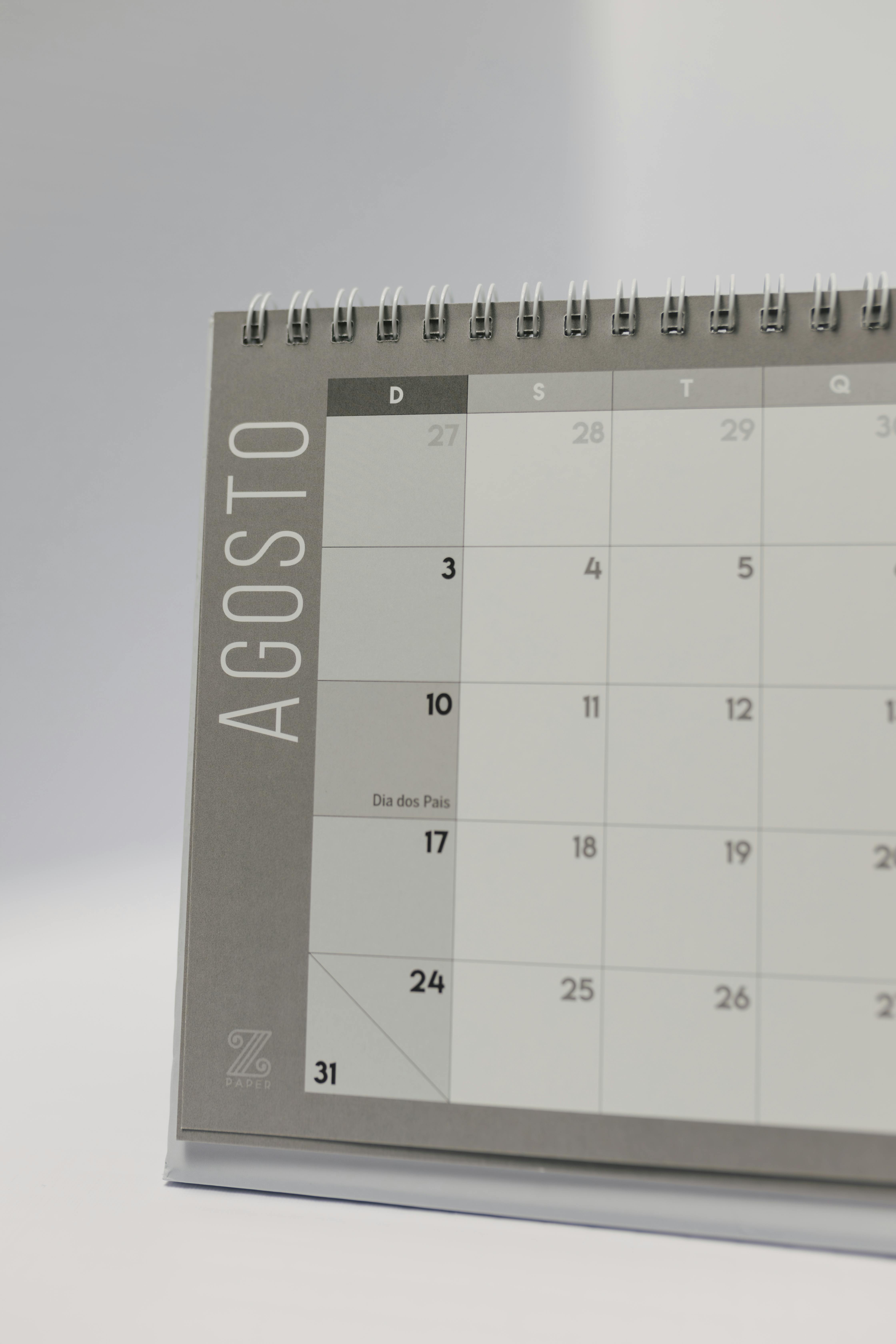 August Calendar on Desk with Spiral Binding · Free Stock Photo
