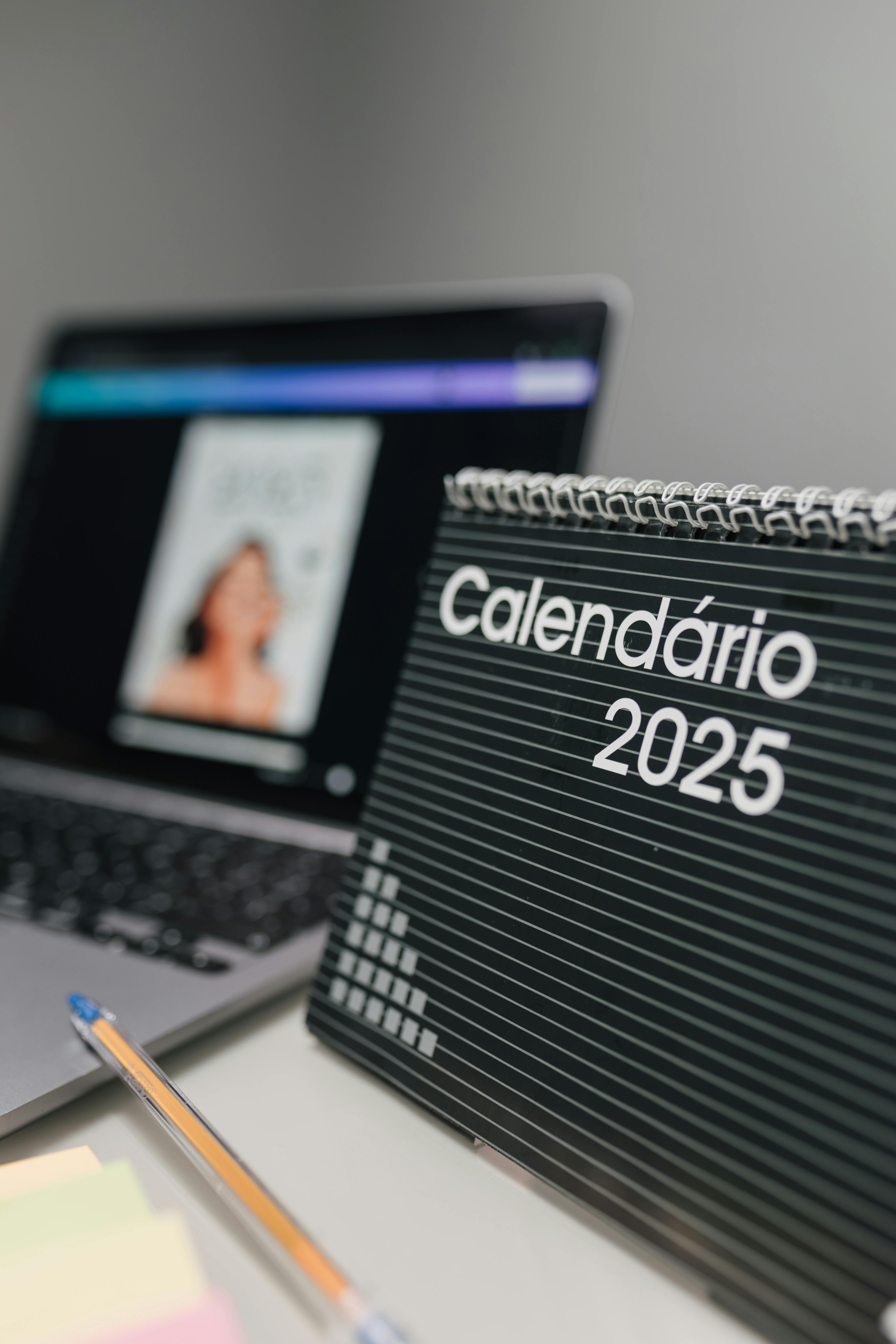 Desk Setup with 2025 Calendar and Laptop · Free Stock Photo