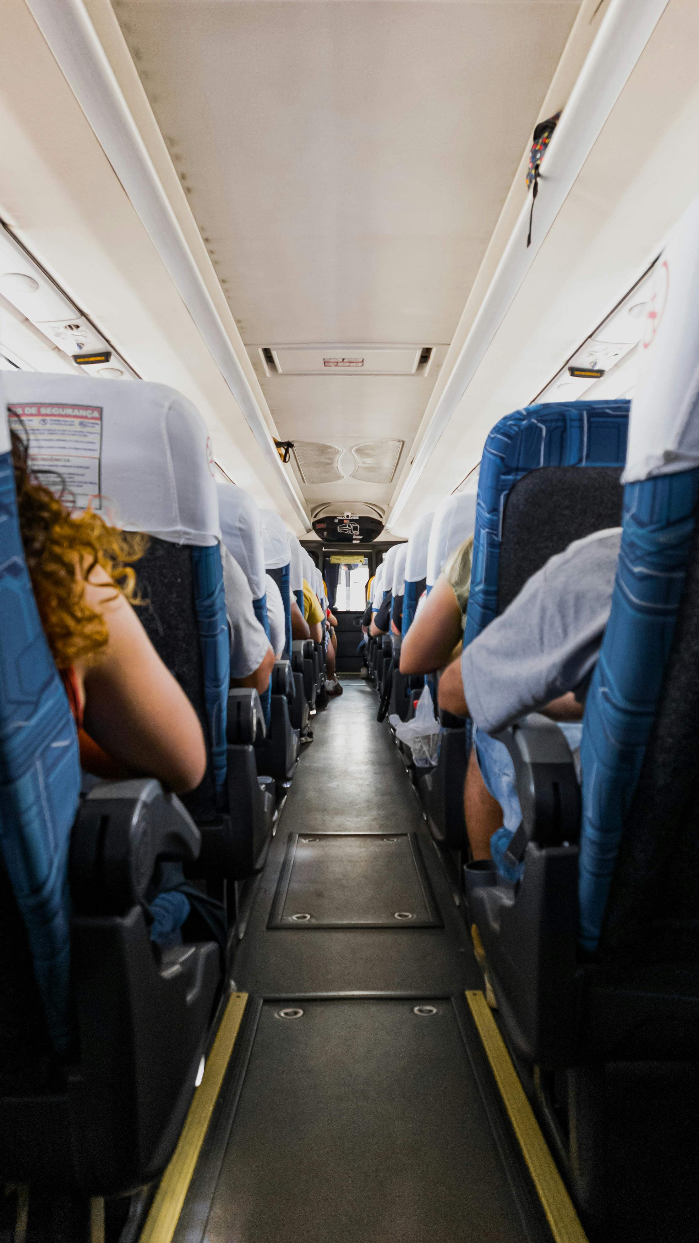 Travelers Seated on a Bus Interior View · Free Stock Photo