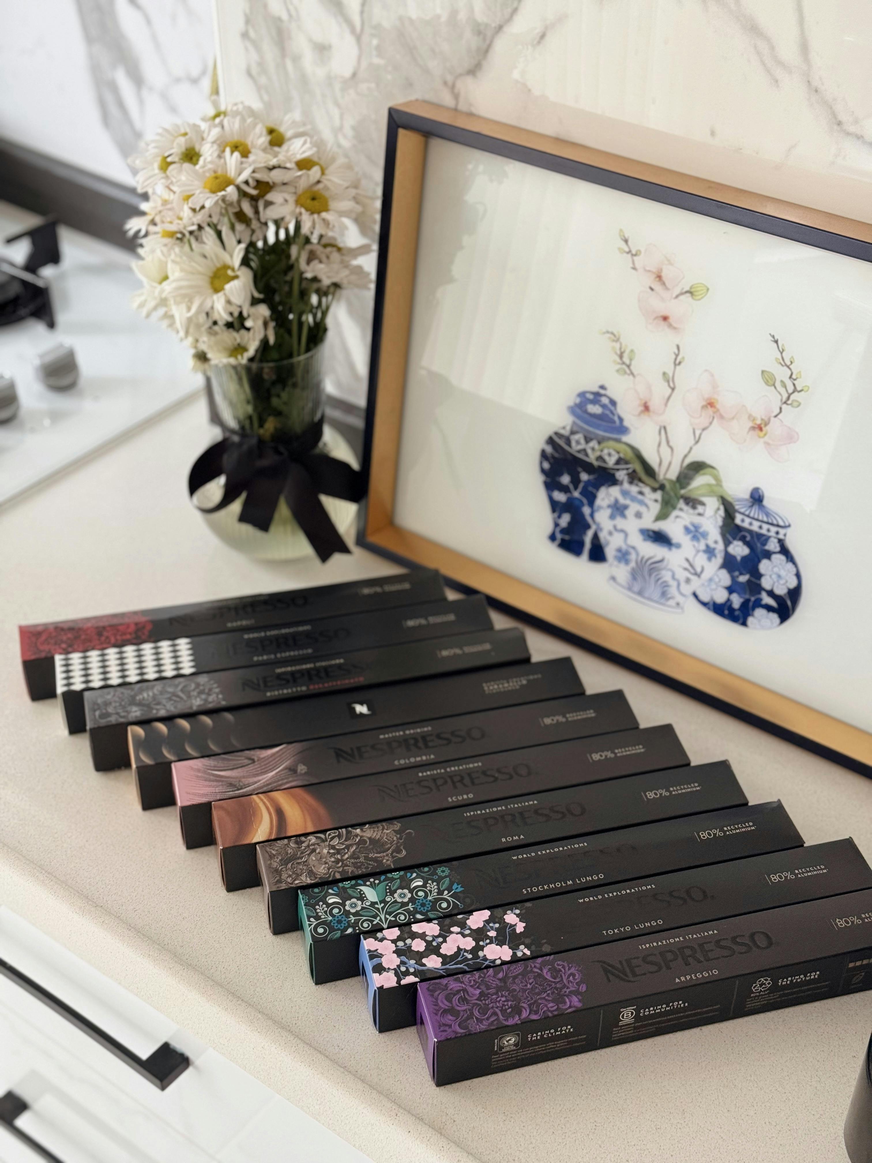 Elegant Nespresso Capsules Display on Marble Counter · Free Stock Photo