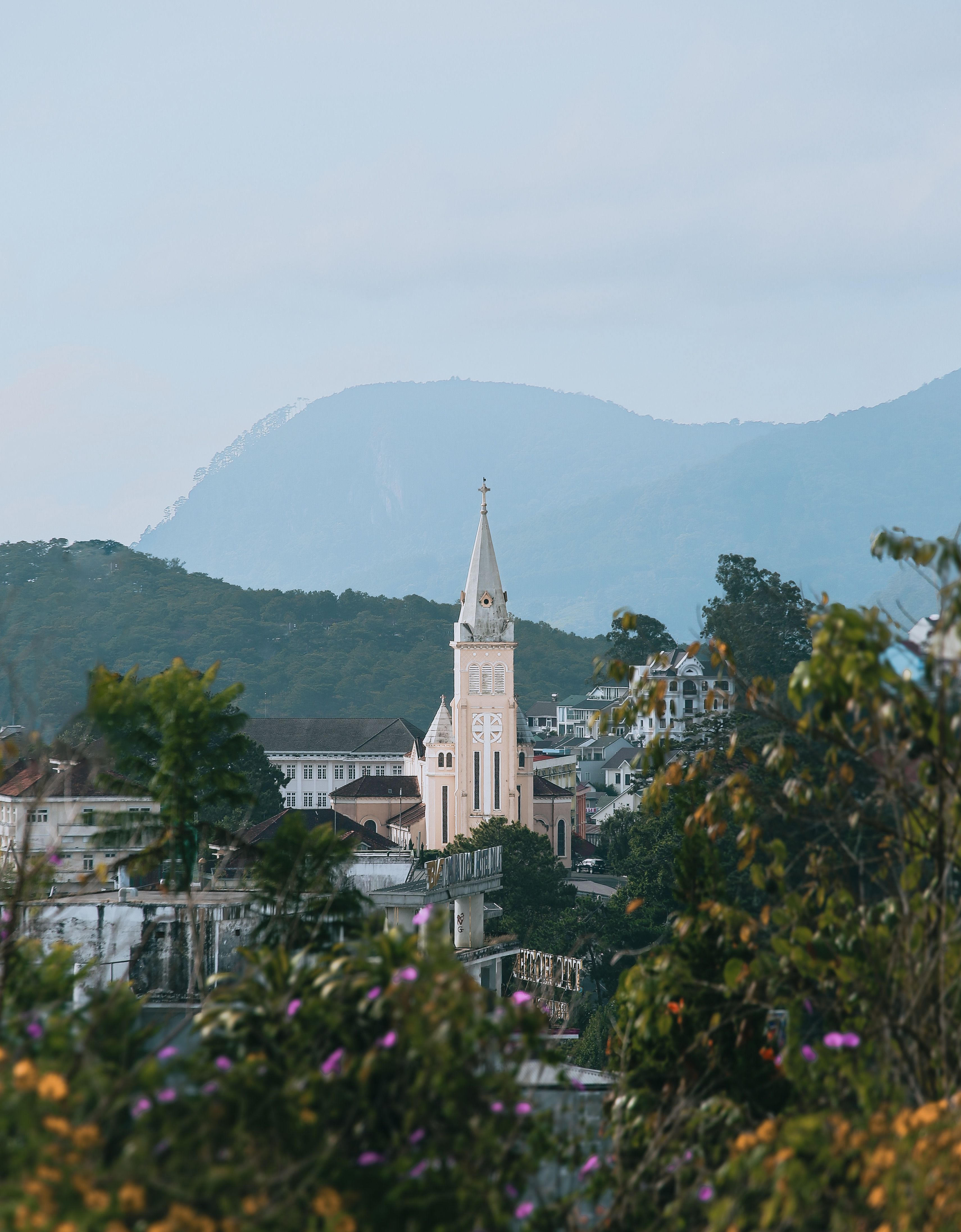 Dalat Cityscape with Iconic Church and Mountain · Free Stock Photo