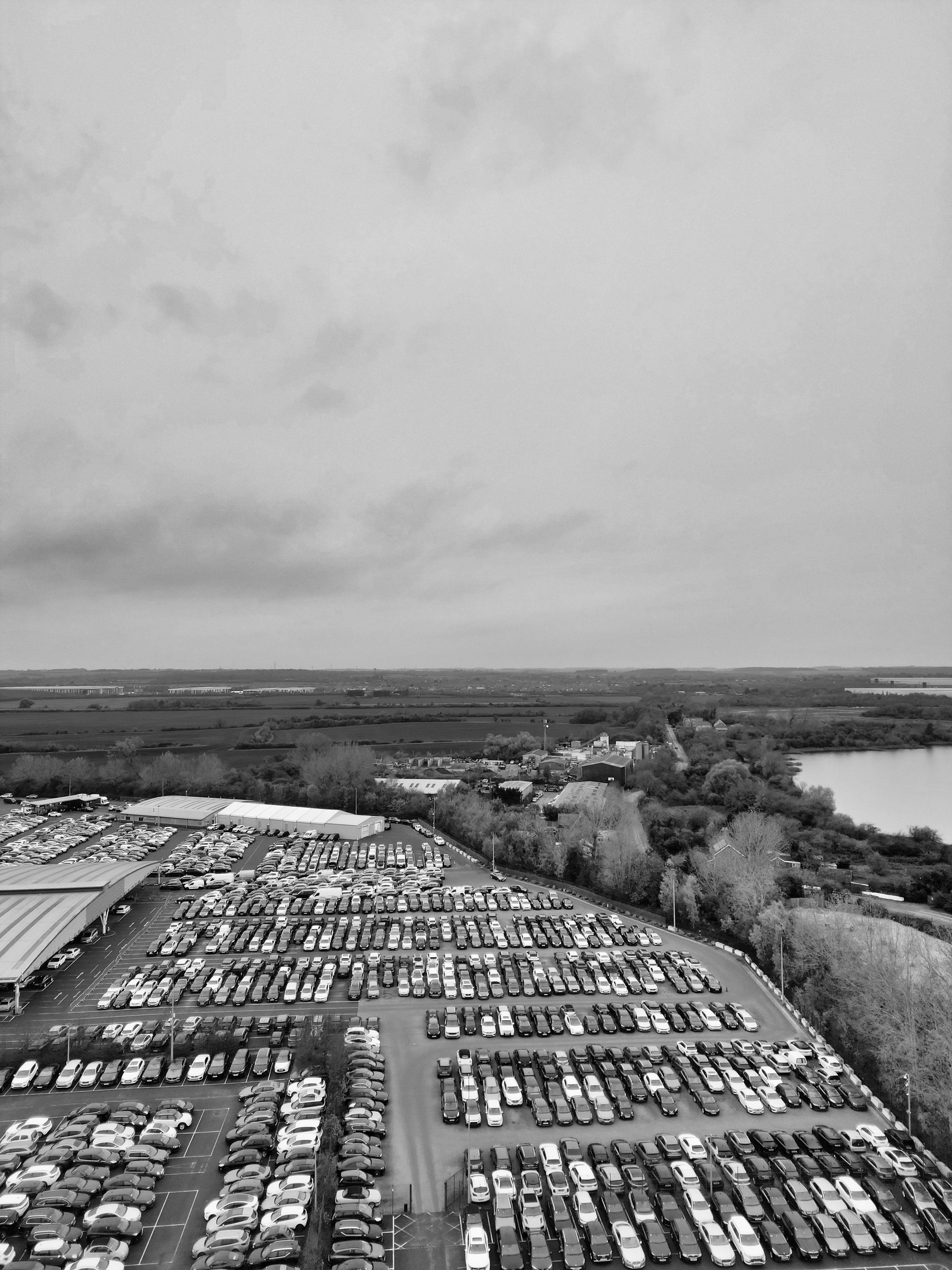Aerial View of Car Parking Lot near River · Free Stock Photo
