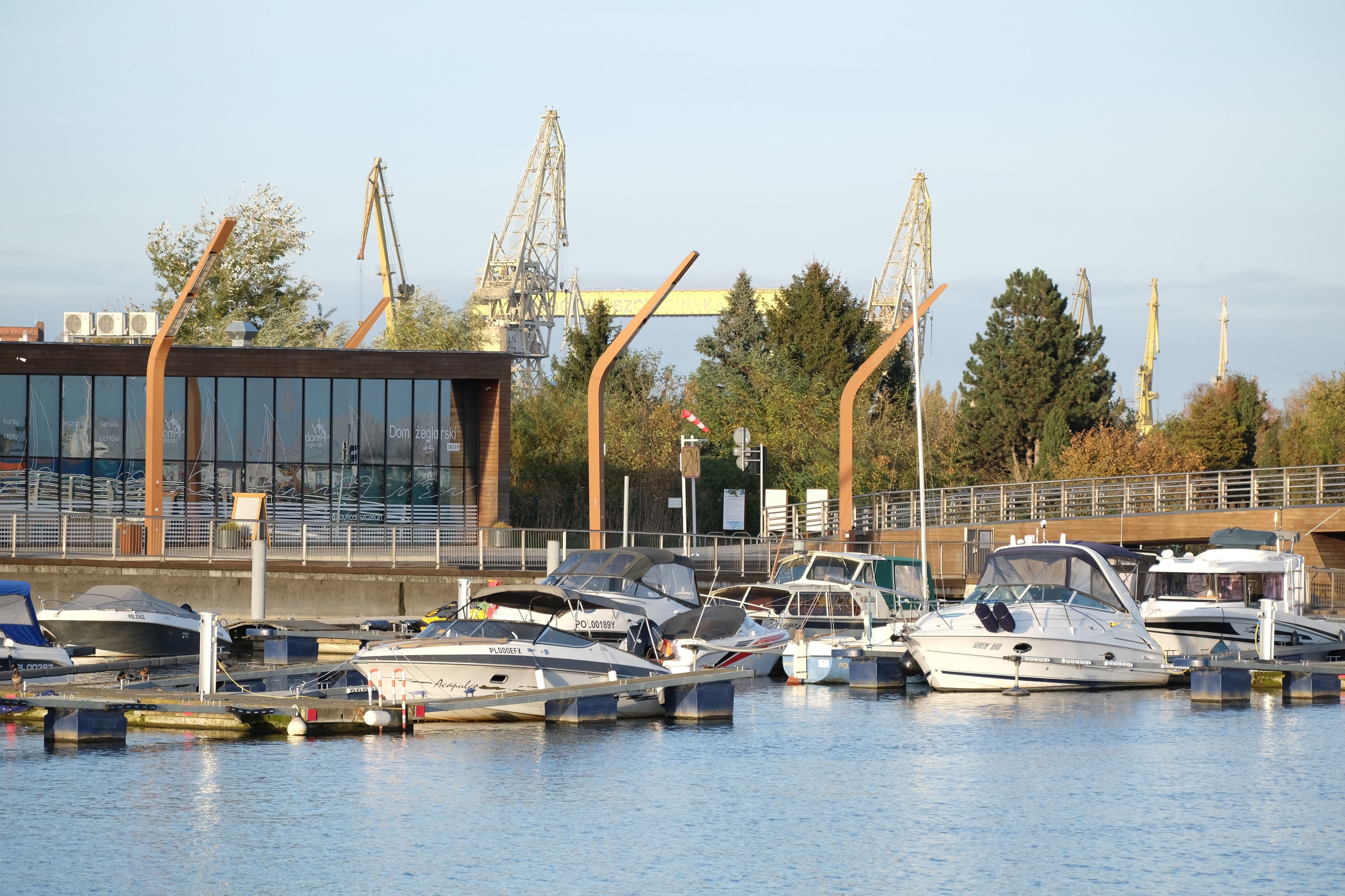 Modern Marina with Boats and Cranes at Sunset · Free Stock Photo