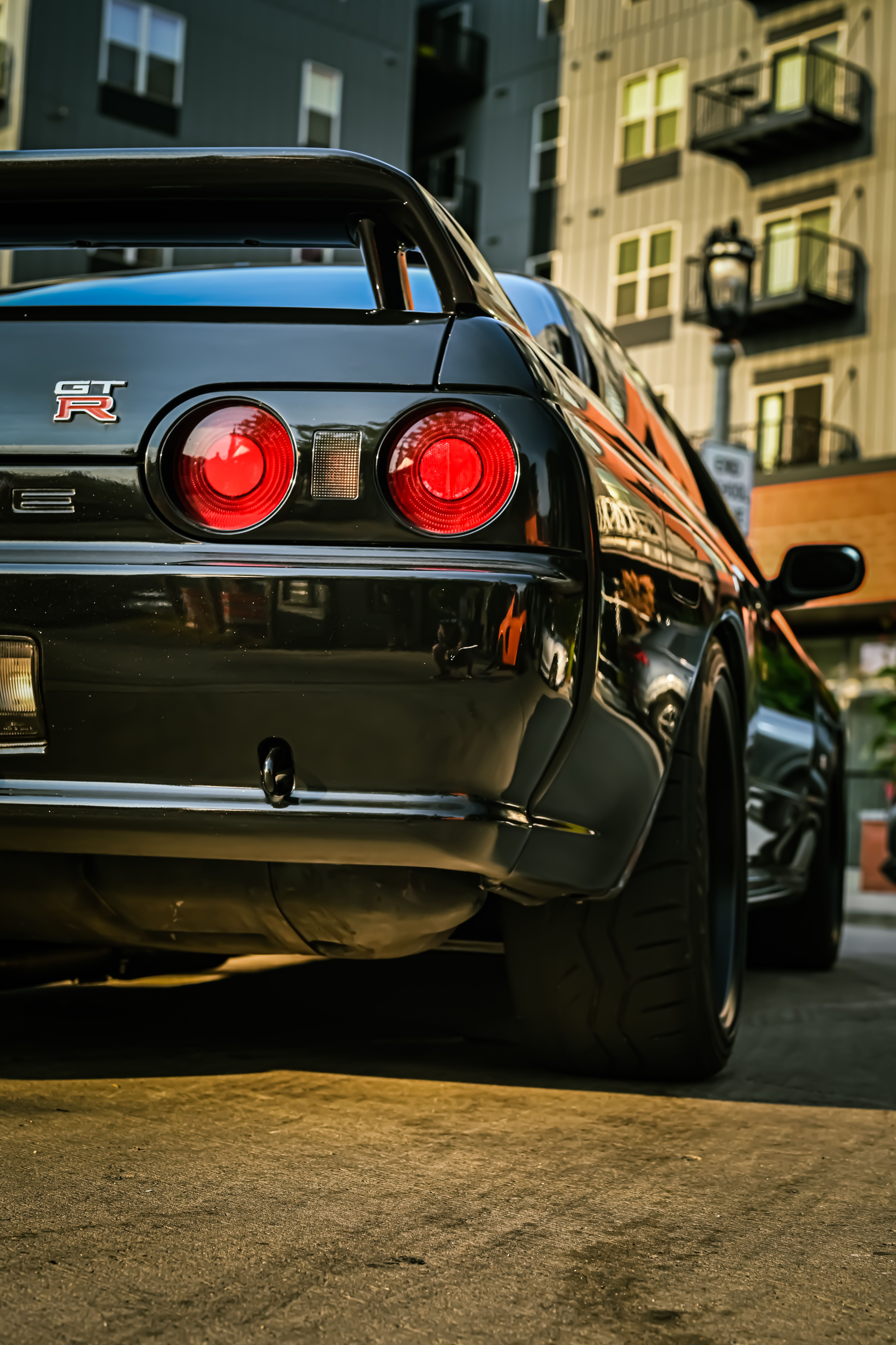 Classic Black Sports Car in Urban Setting · Free Stock Photo