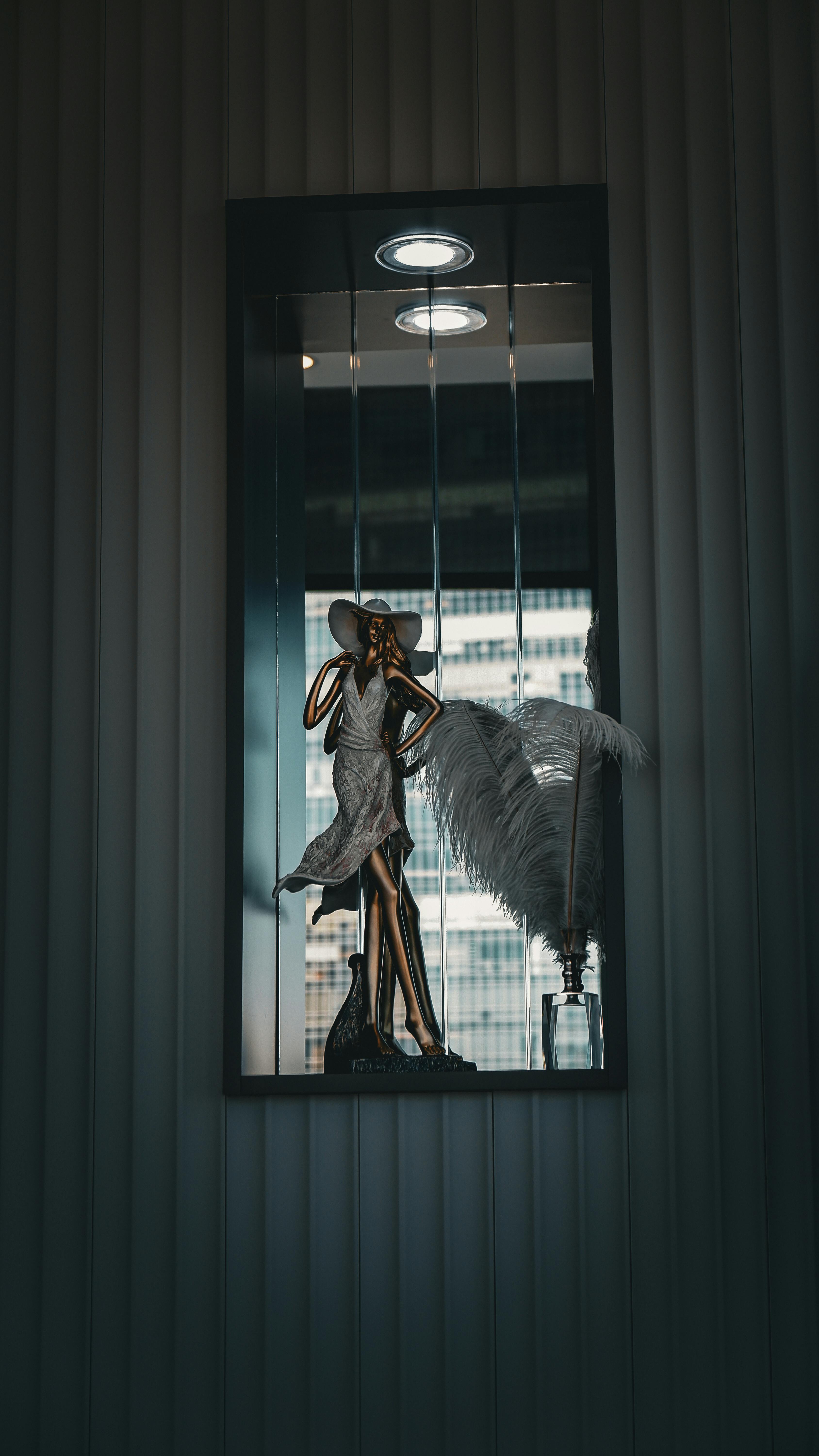 Elegant Statue Reflection in Modern Display · Free Stock Photo