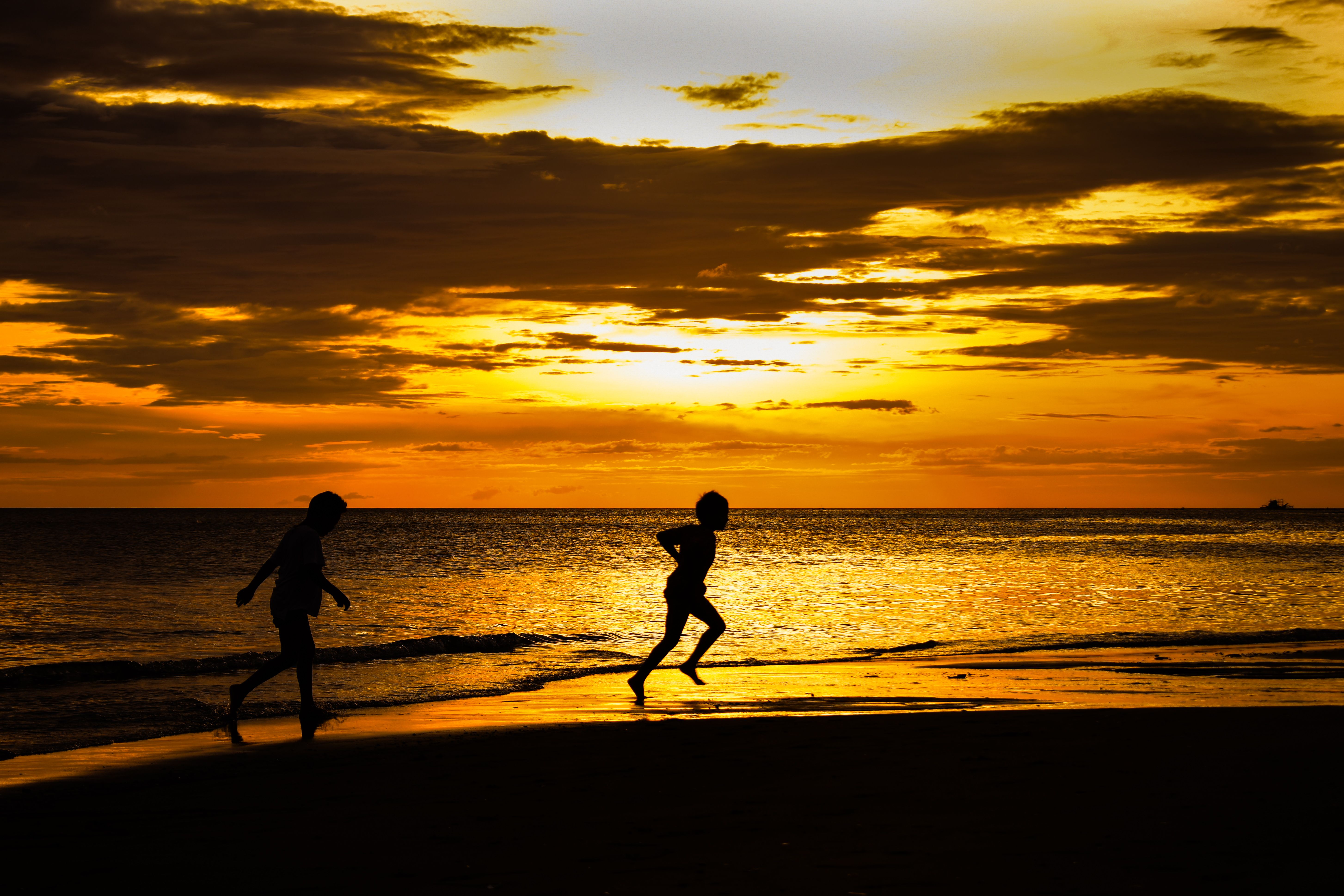 Children Running at Sunset Beach in Bayawan · Free Stock Photo