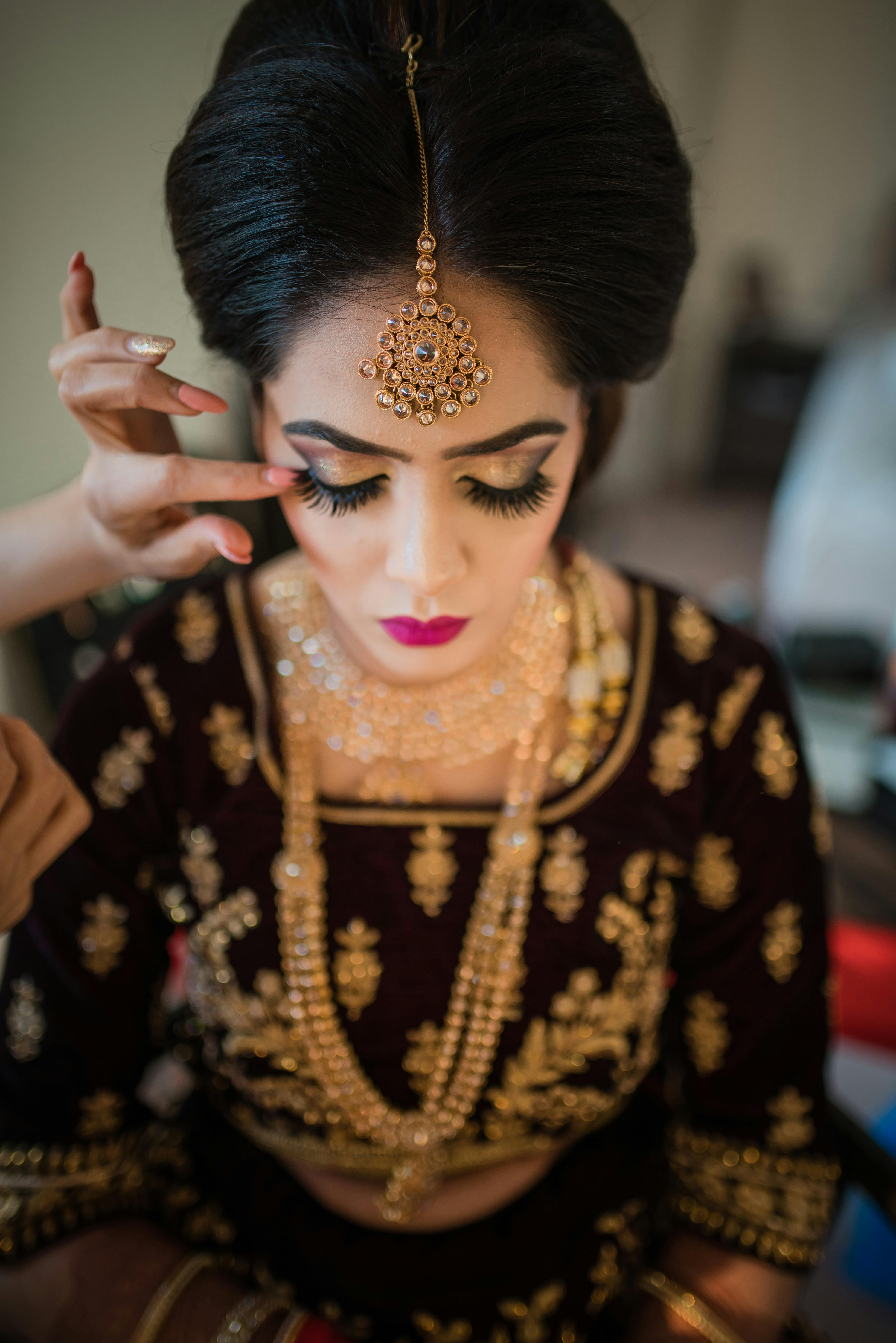 Elegant Indian Bride Getting Makeup Done · Free Stock Photo