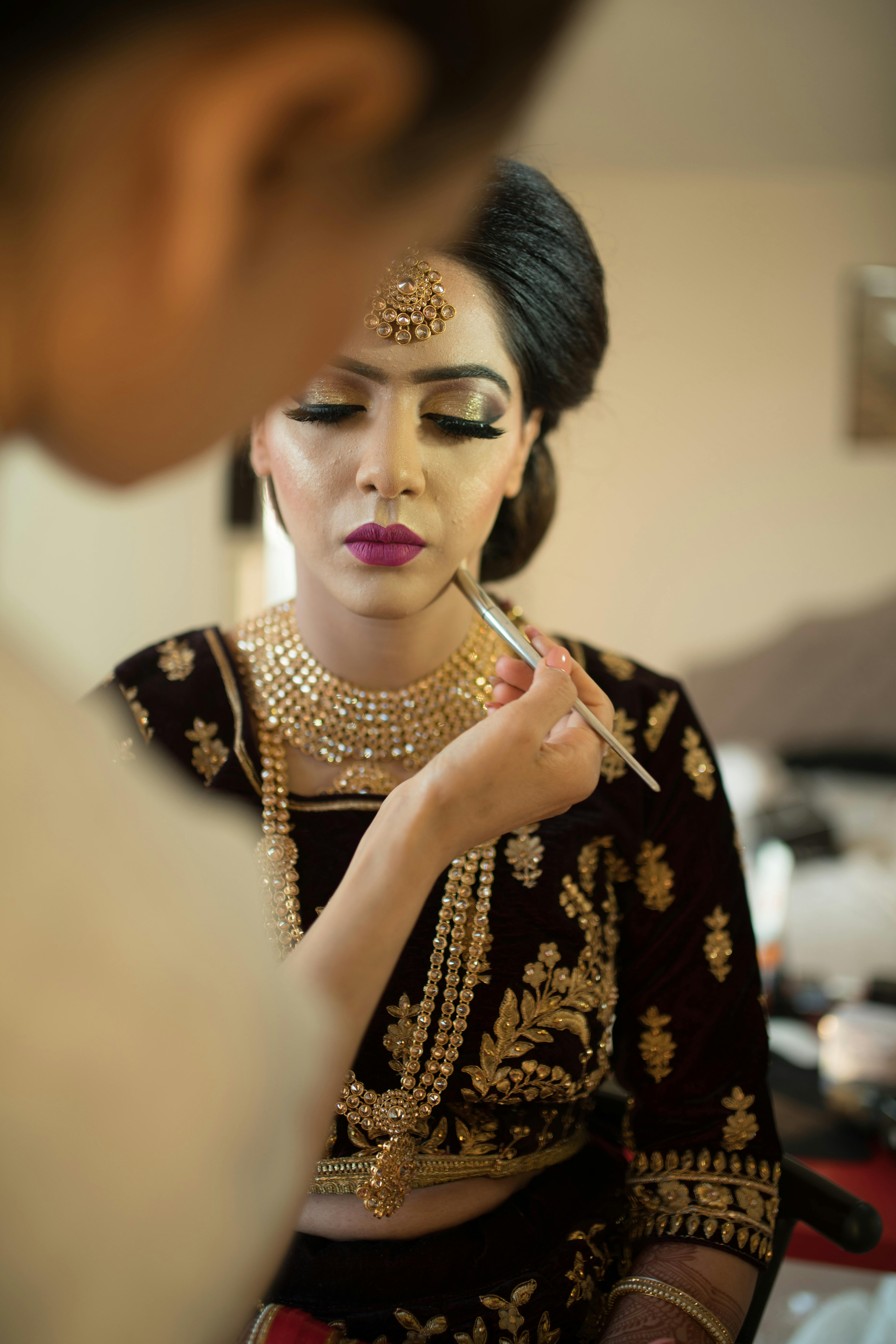 Traditional Bridal Makeup Session with Jewelry · Free Stock Photo