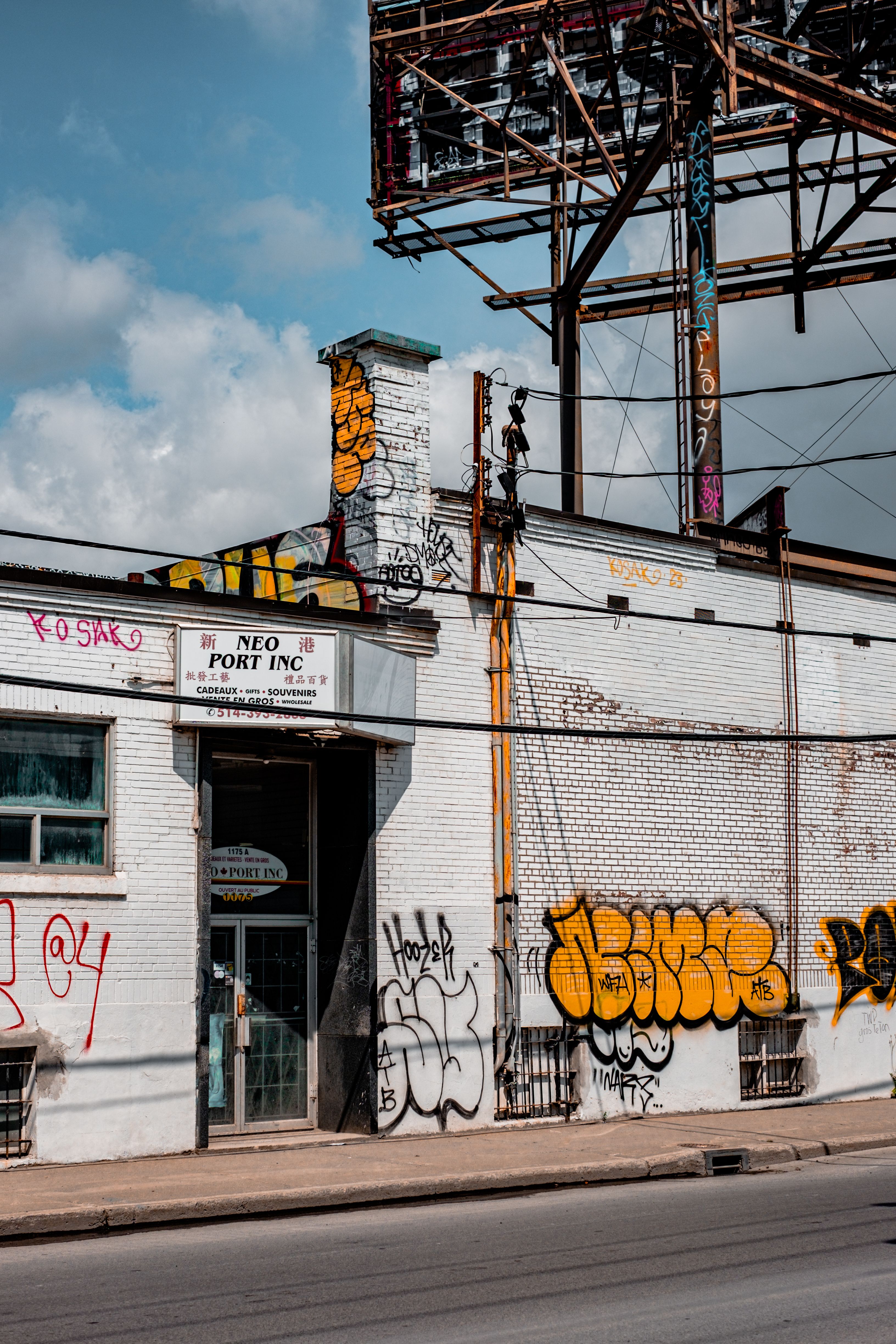 Urban Graffiti on Industrial Building with Billboard · Free Stock Photo