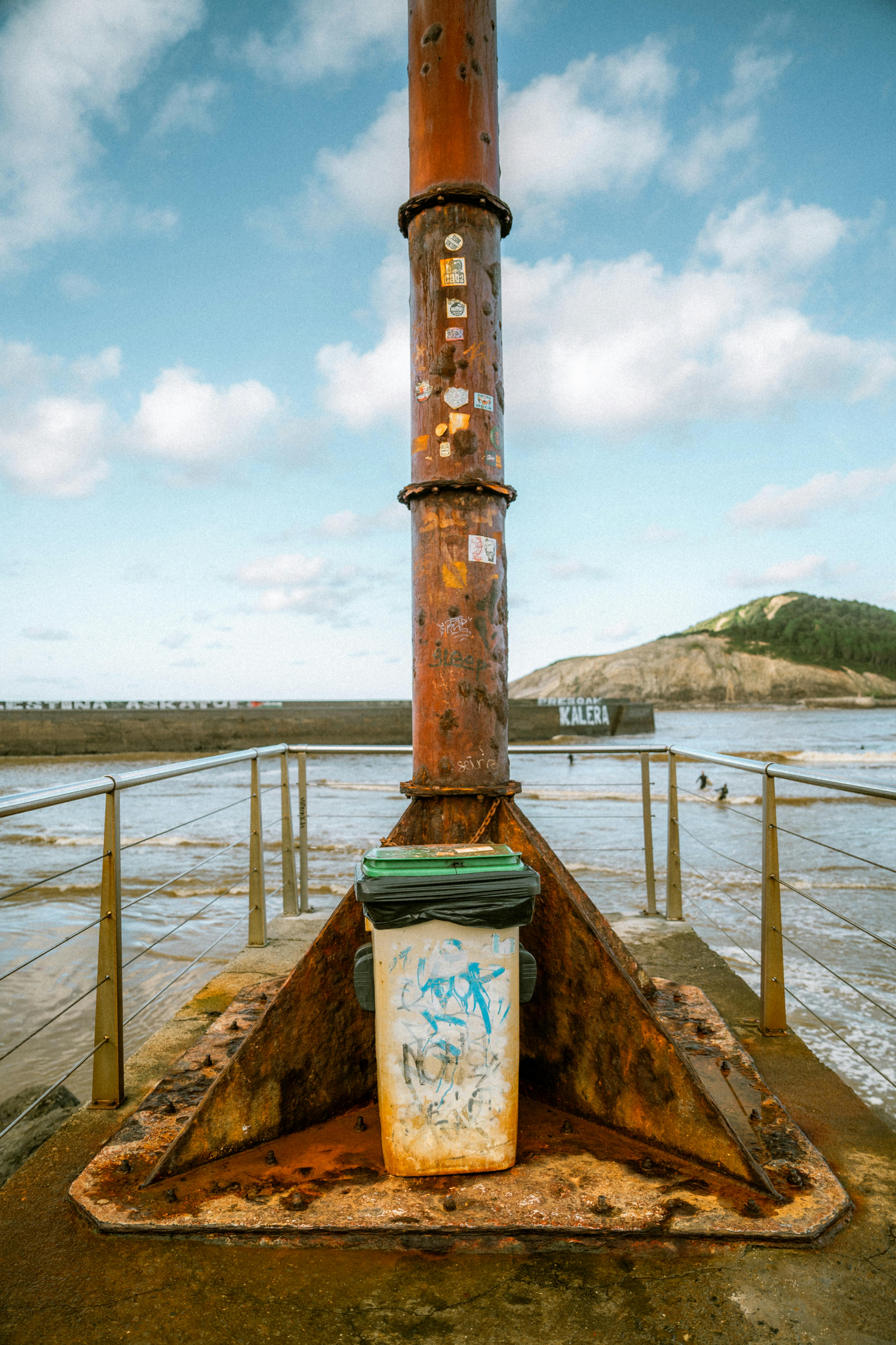 Rusty Pier Post on Coastal Promenade · Free Stock Photo