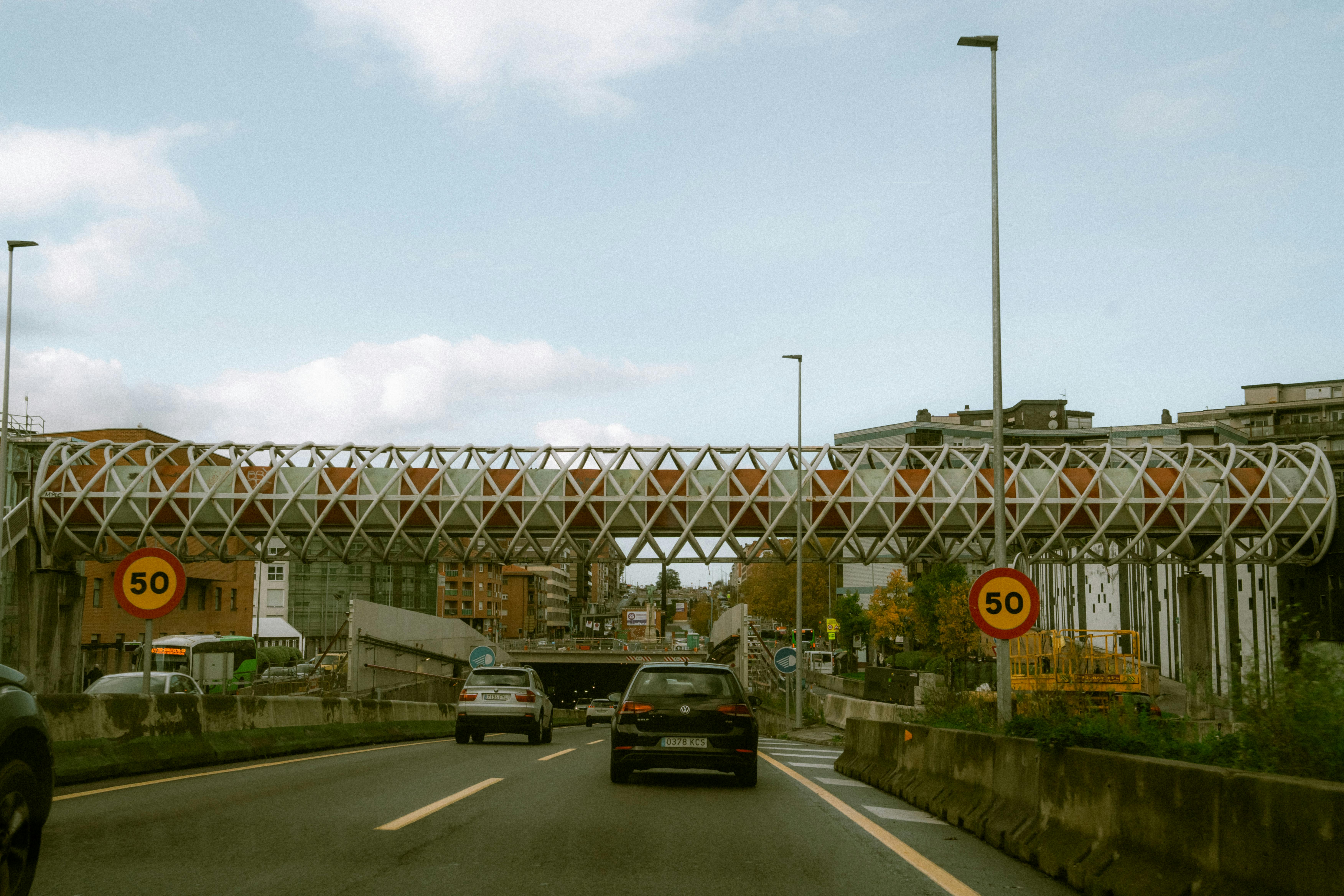 Urban highway scene with unique overpass architecture · Free Stock Photo