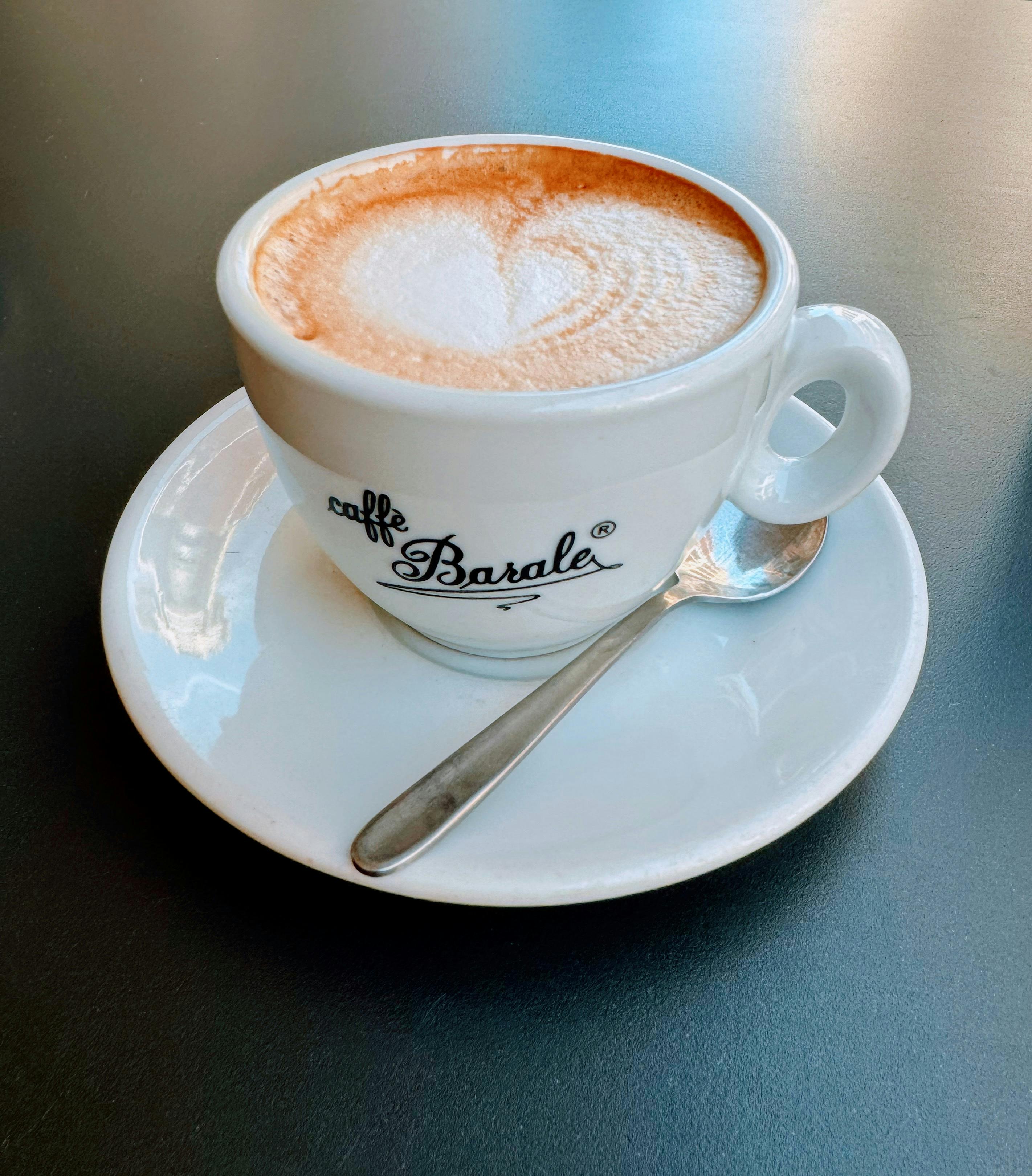 Latte Art Coffee in Italian Cafe Setting · Free Stock Photo