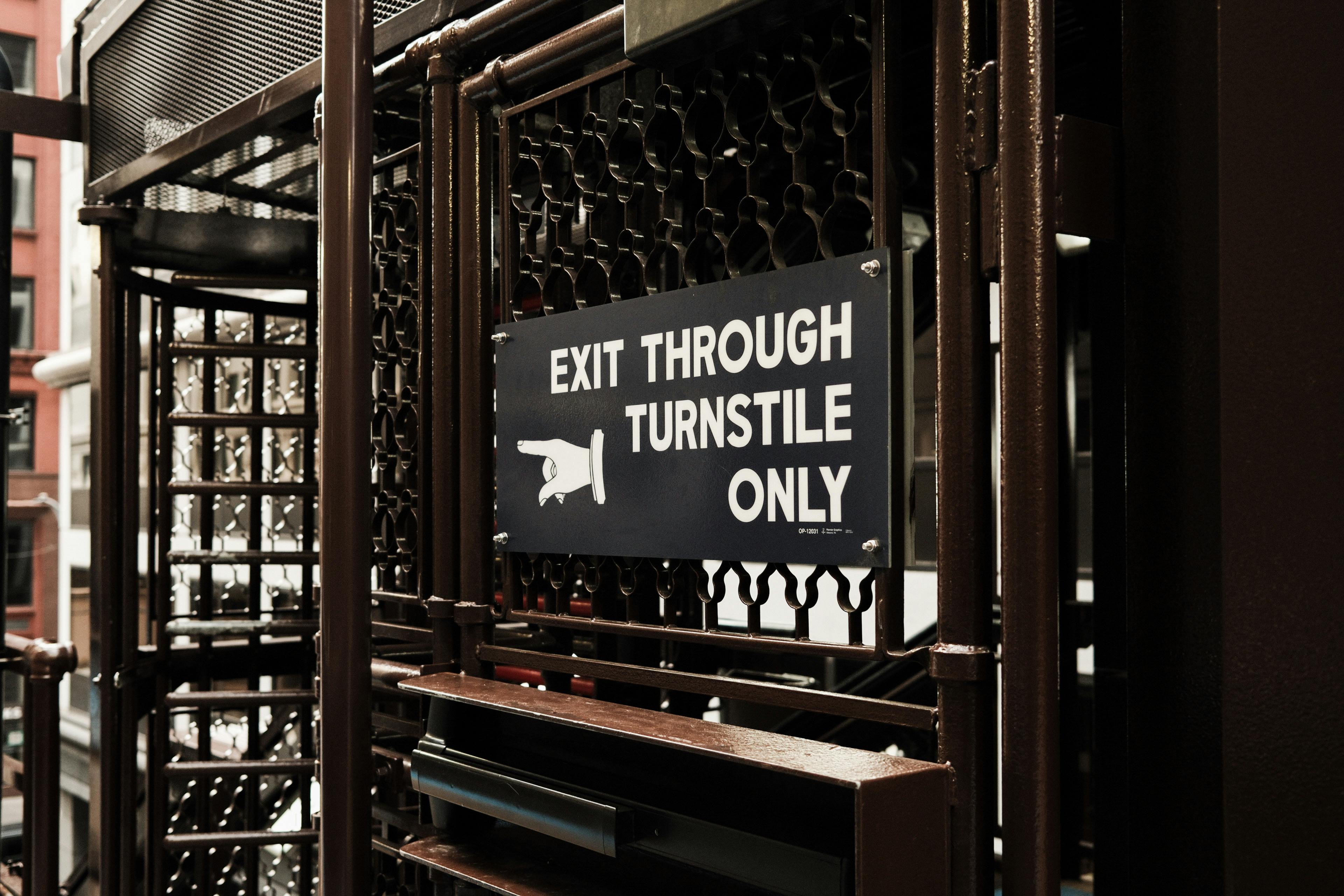 Urban Exit Turnstile Sign at Train Station · Free Stock Photo