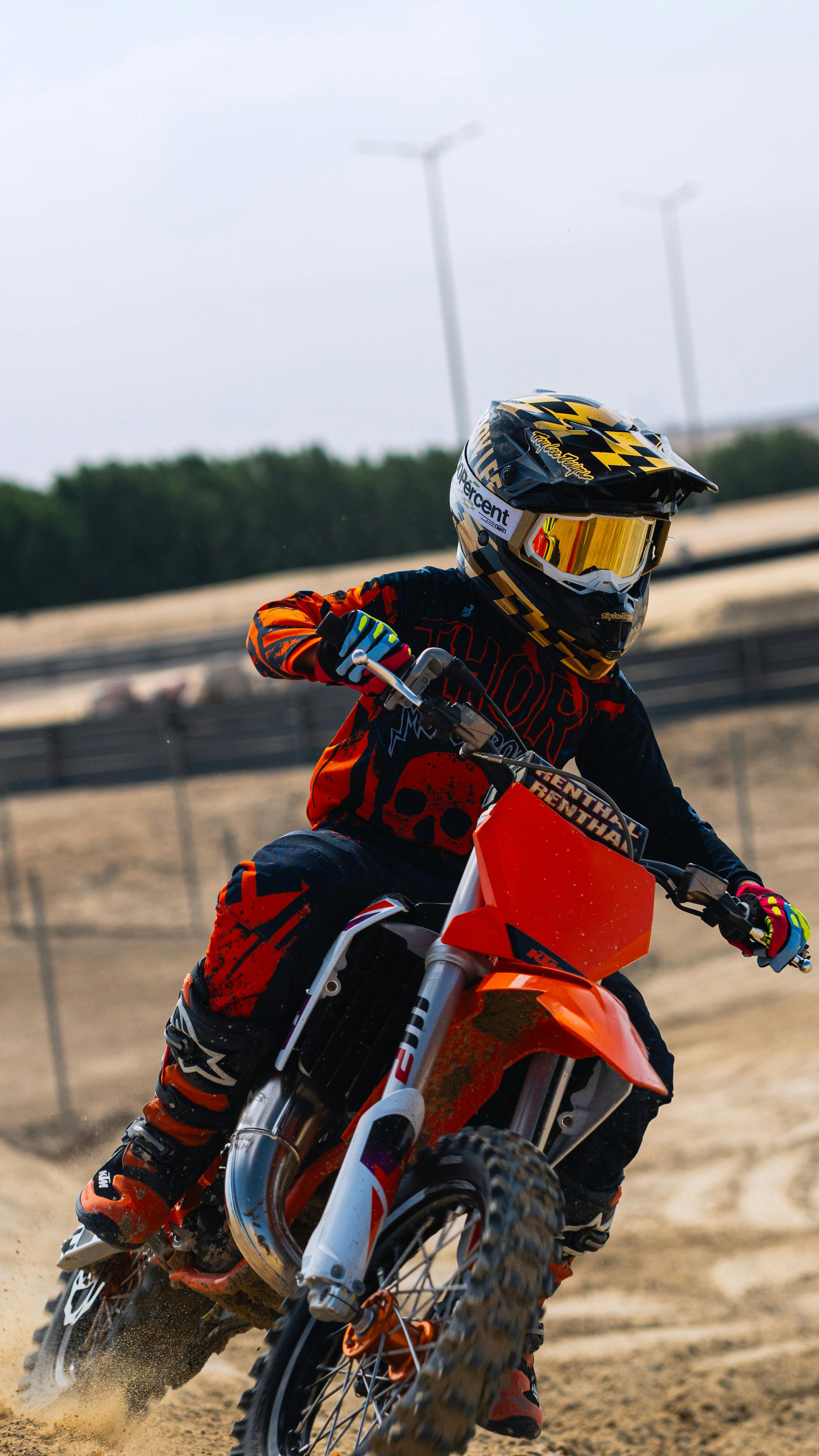 Young motocross rider on dirt track · Free Stock Photo