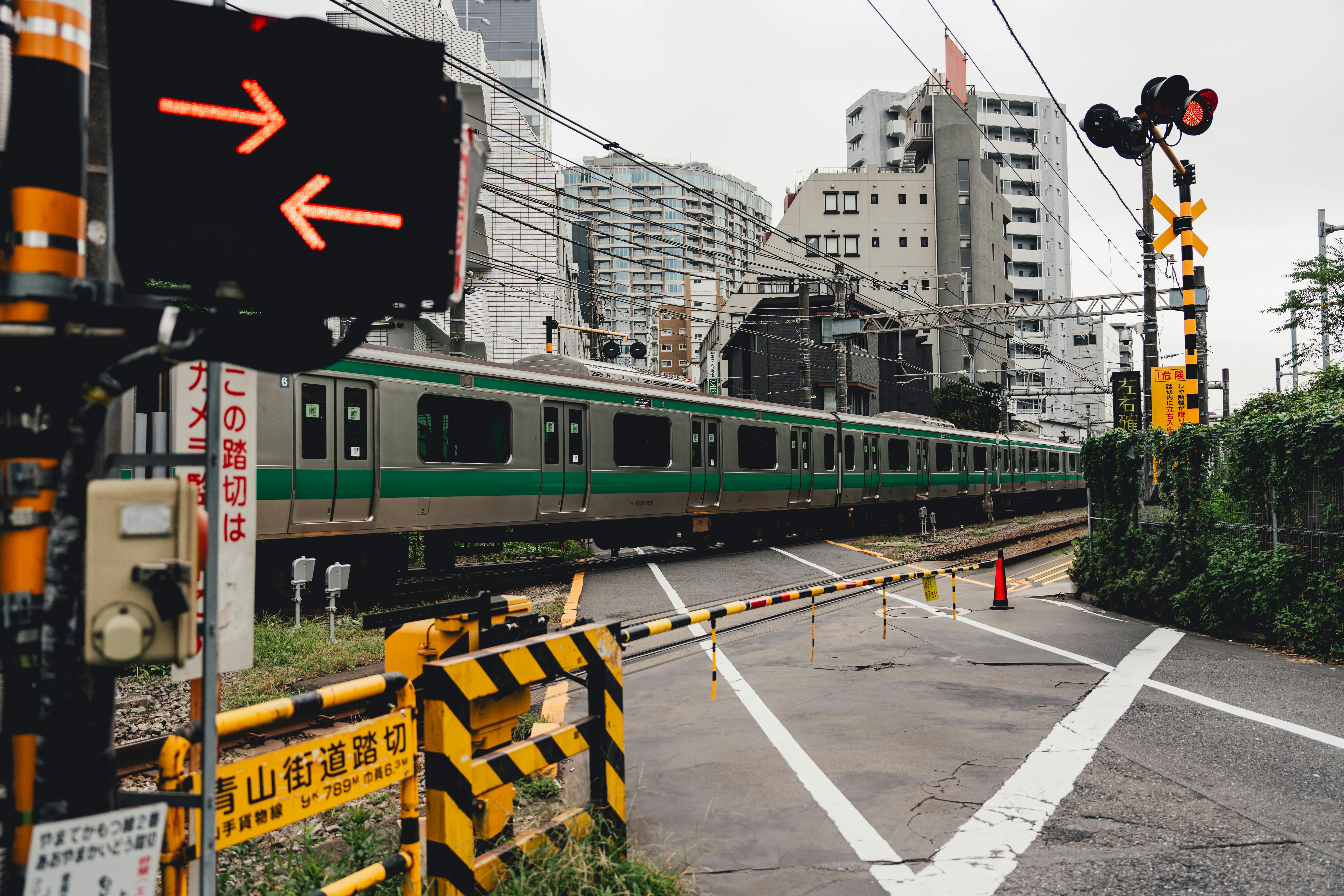 Urban Train Crossing in a Japanese Cityscape · Free Stock Photo