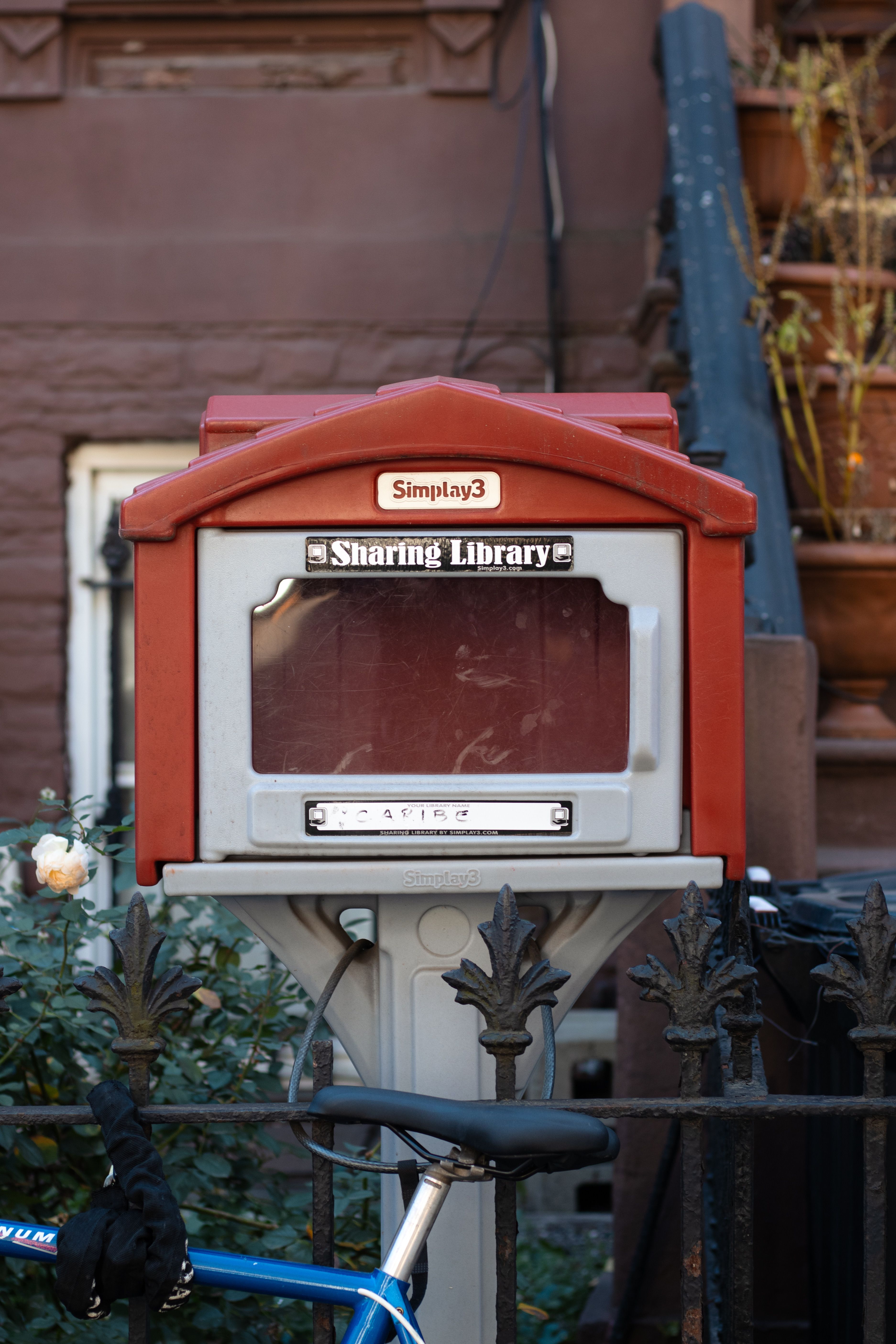 Outdoor Sharing Library with Bicycle Nearby · Free Stock Photo