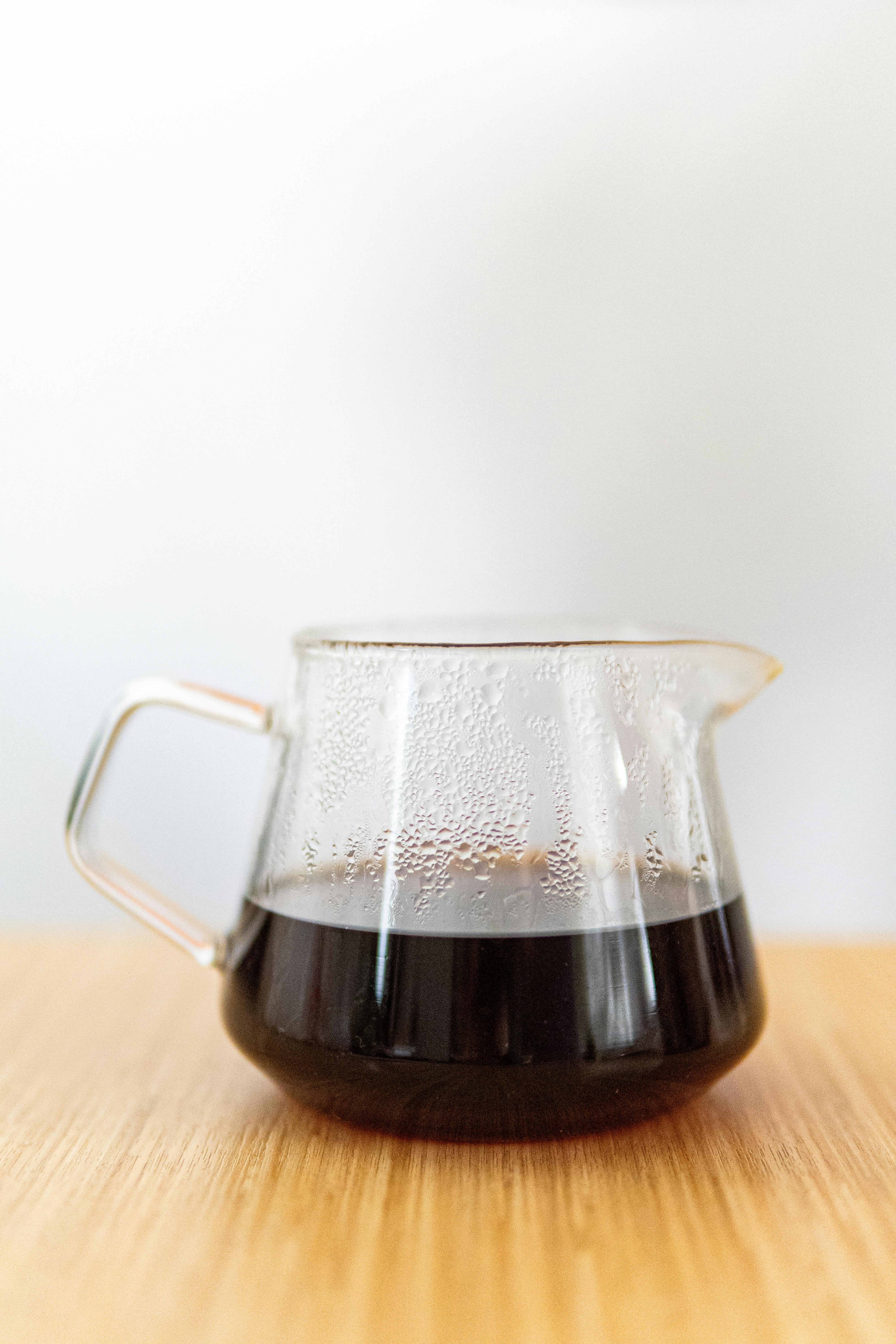 Minimalist Glass Coffee Carafe on Wooden Table · Free Stock Photo