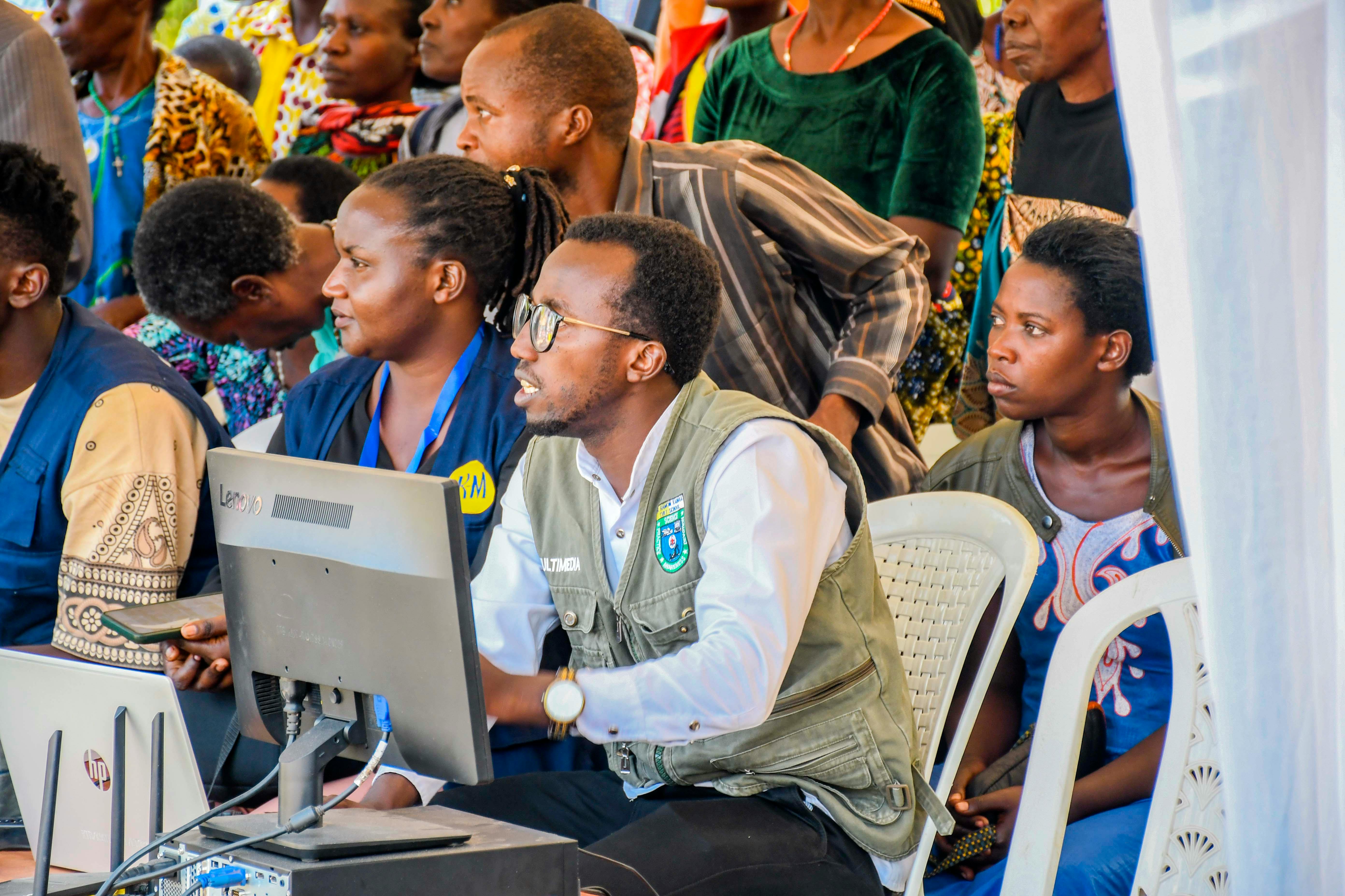 Community Gathering with Technology in Rwanda · Free Stock Photo