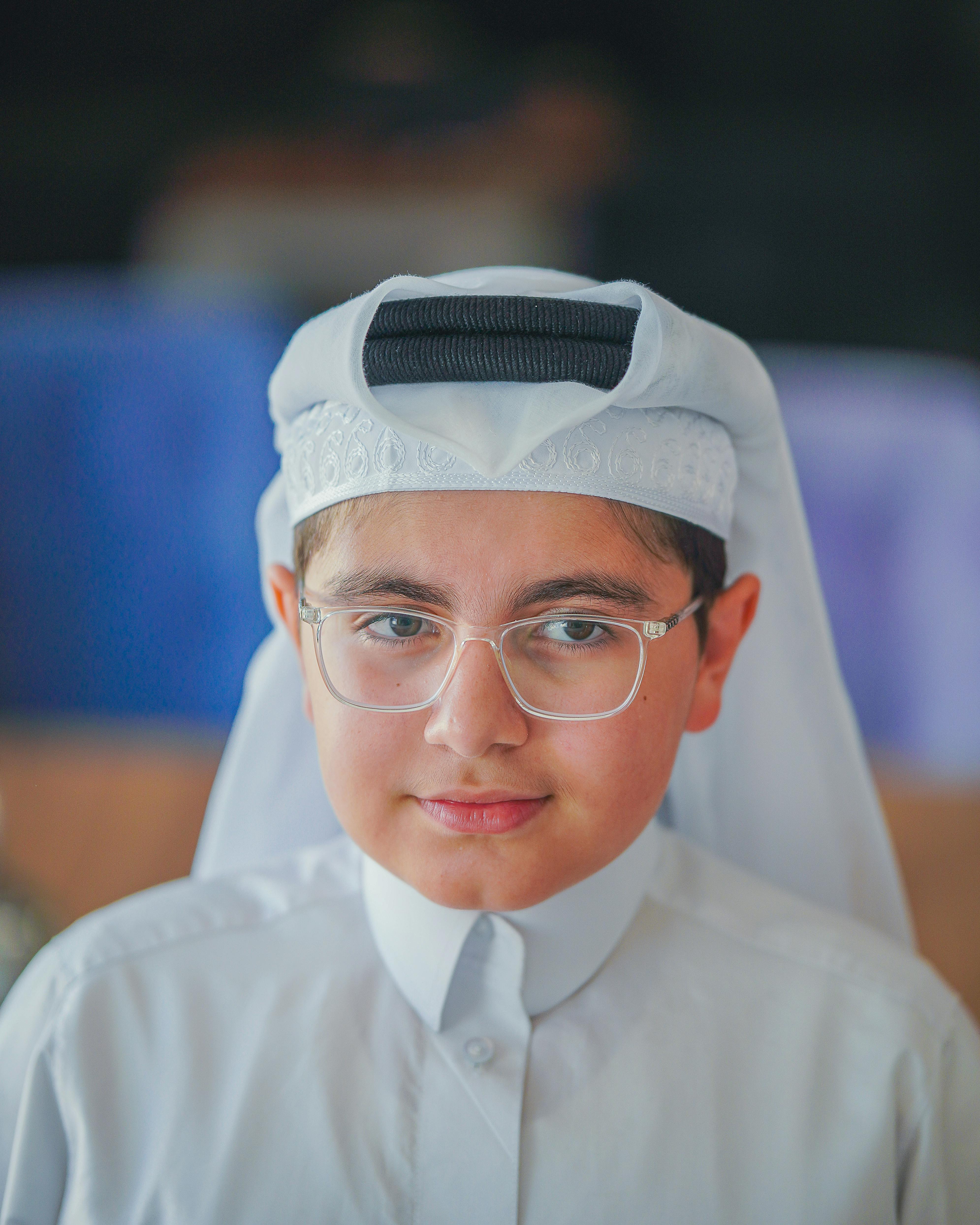 Portrait of a Young Boy in Traditional Qatari Attire · Free Stock Photo