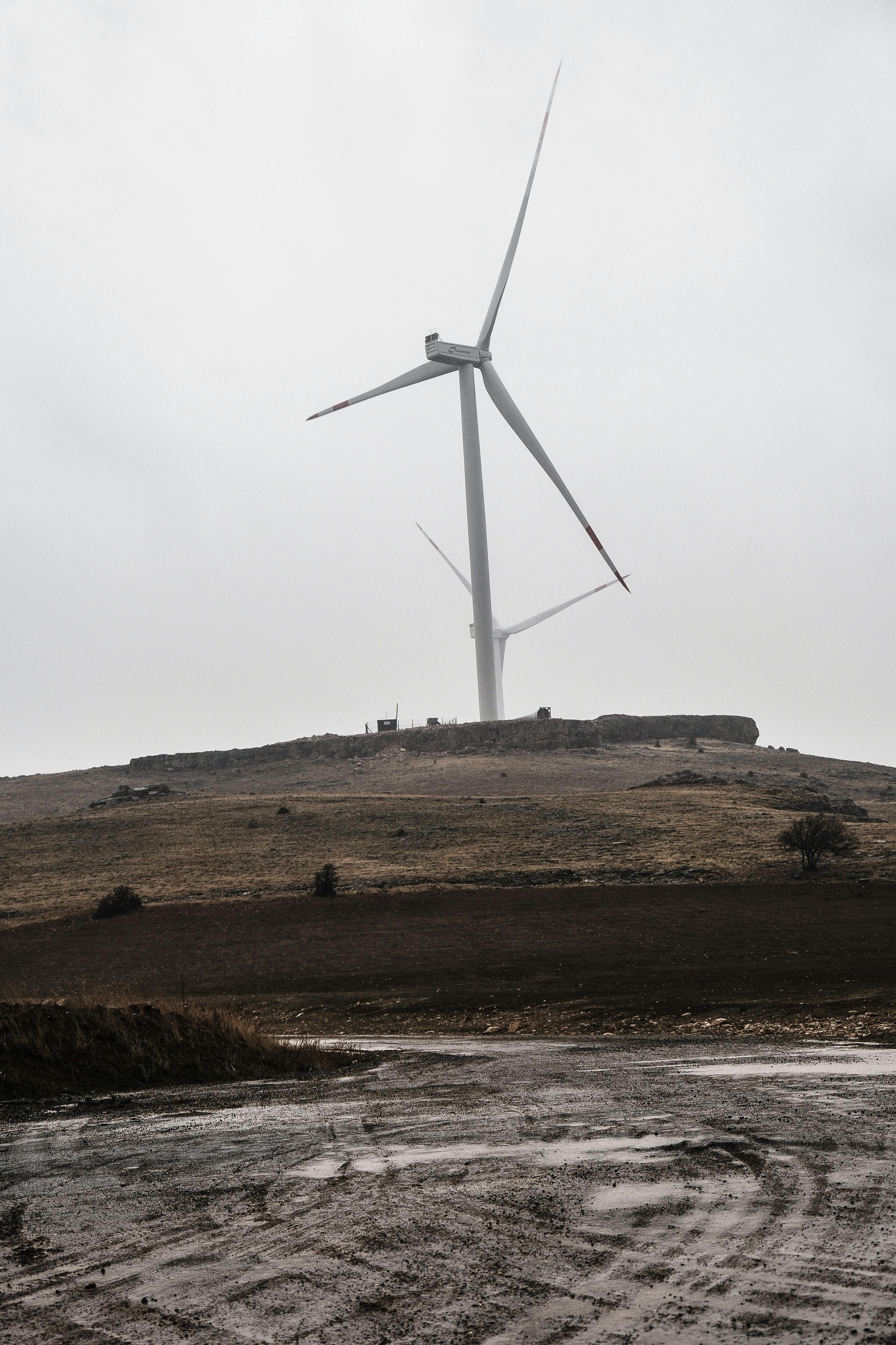 Wind Farm on Green Grass Pastures · Free Stock Photo